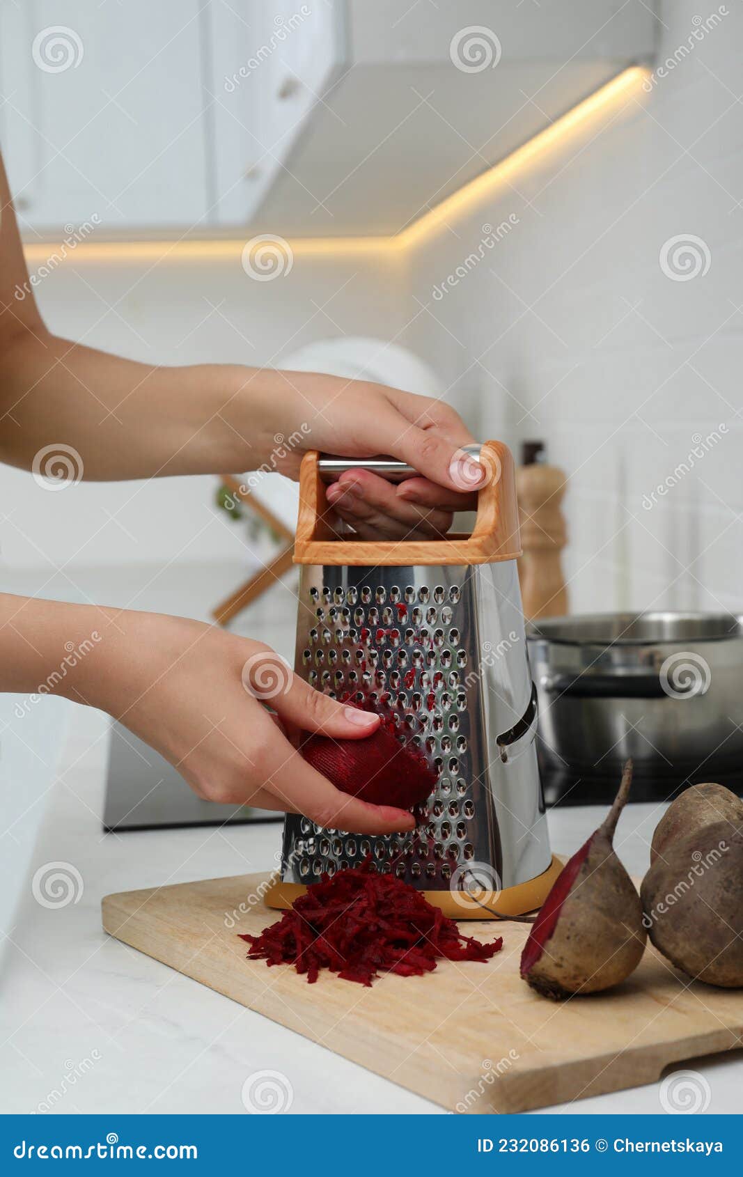 Woman Grating Fresh Beetroot at Kitchen Counter, Closeup Stock Photo ...