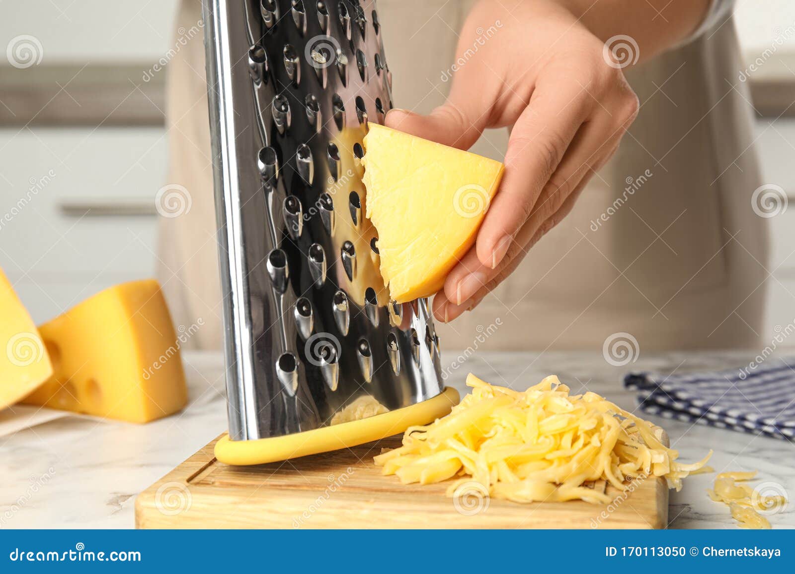 Woman Grating Fresh Cheese at Table Stock Photo - Image of delicatessen ...