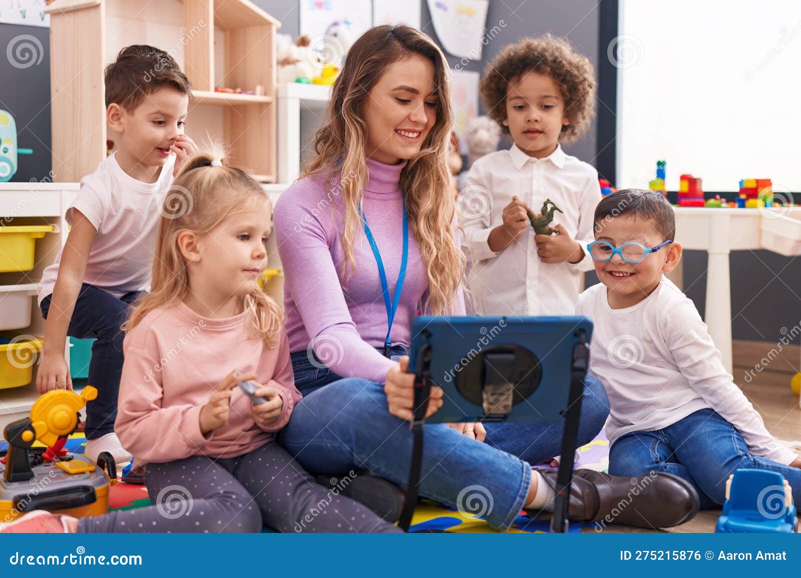Woman and Group of Kids Having Lesson Using Touchpad at Kindergarten ...