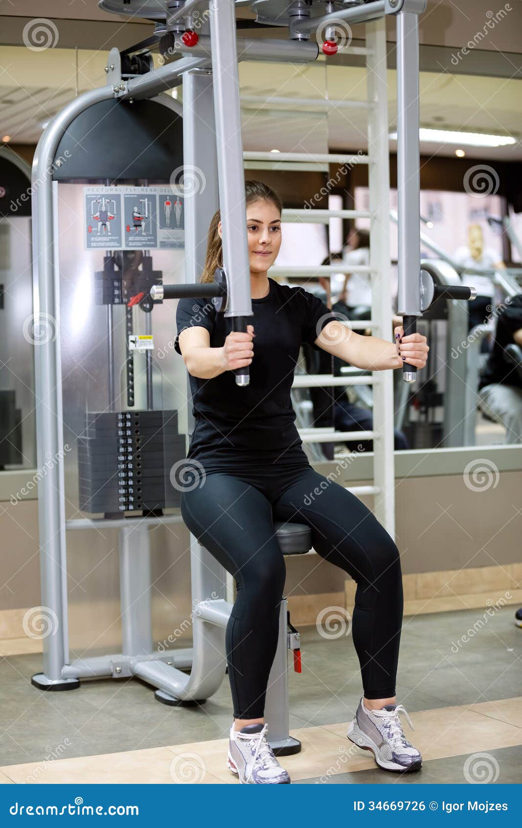 Woman at the gym stock photo. Image of body, chest, machine - 34669726