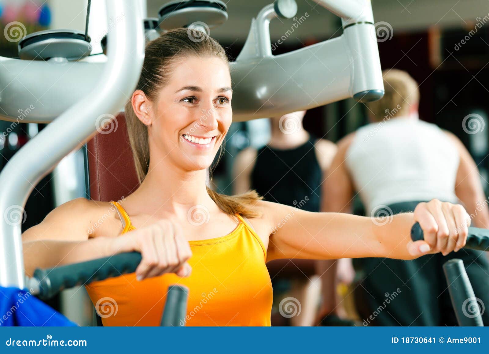 Woman in Gym on Machine Exercising Stock Image - Image of caucasian ...