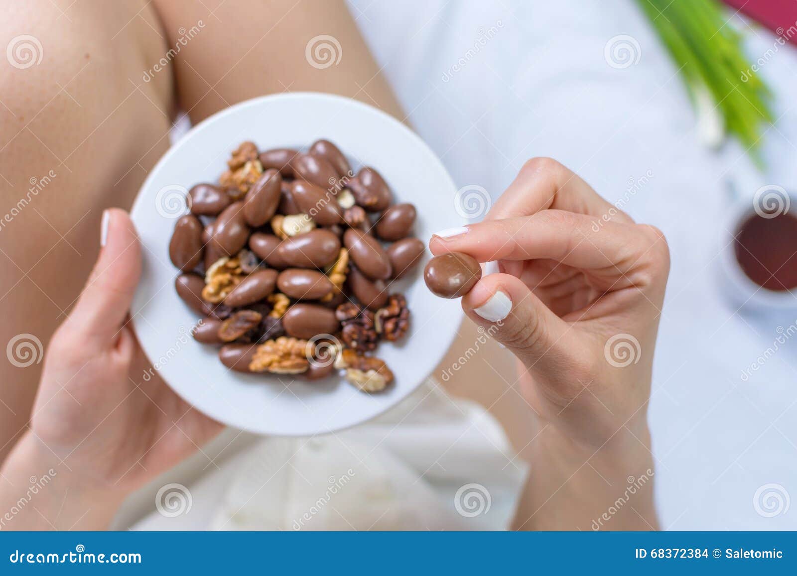 Woman haing a snack in bed stock photo. Image of drink - 68372384