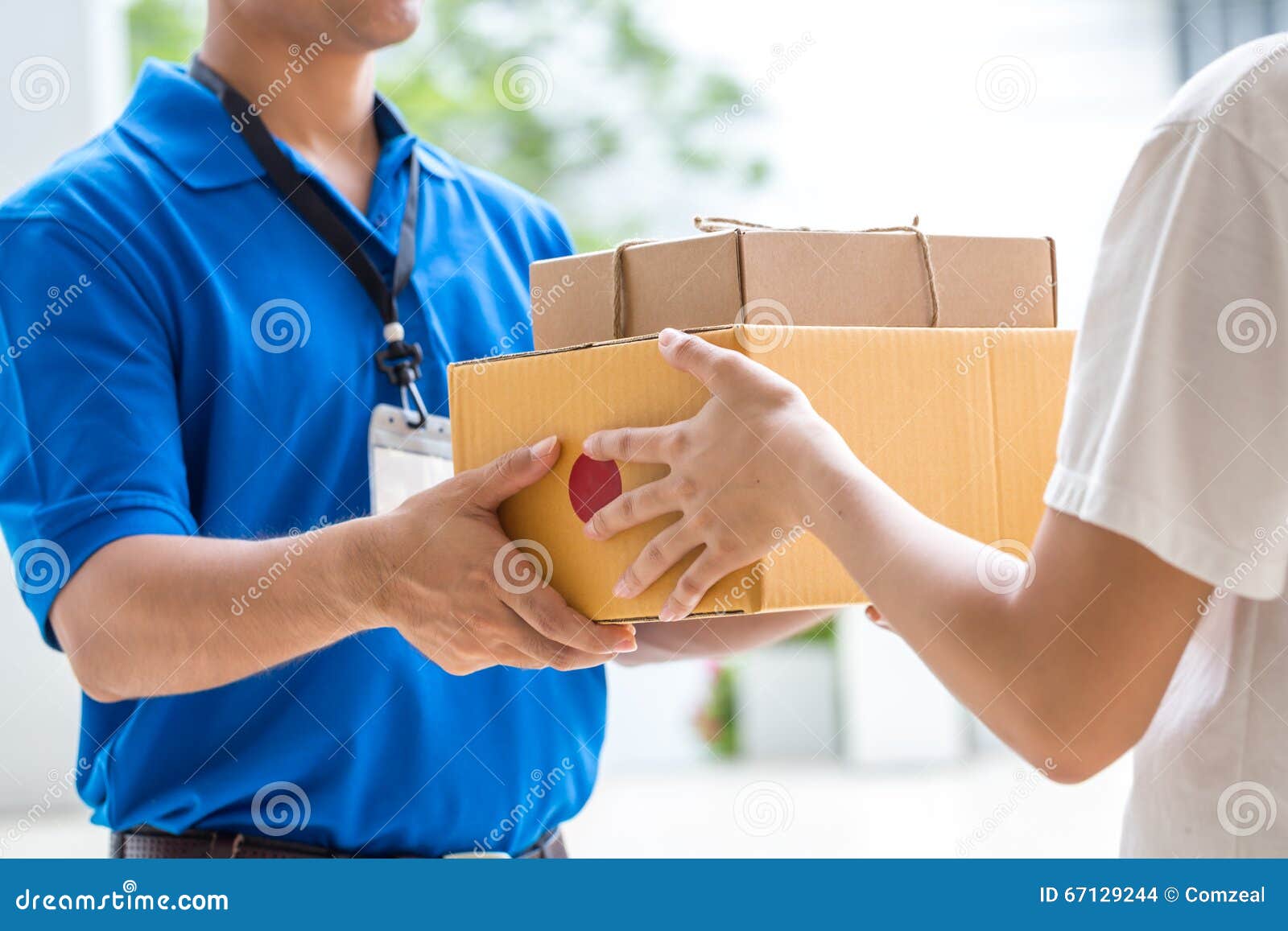 Woman Hand Accepting a Delivery of Boxes from Deliveryman Stock Photo ...