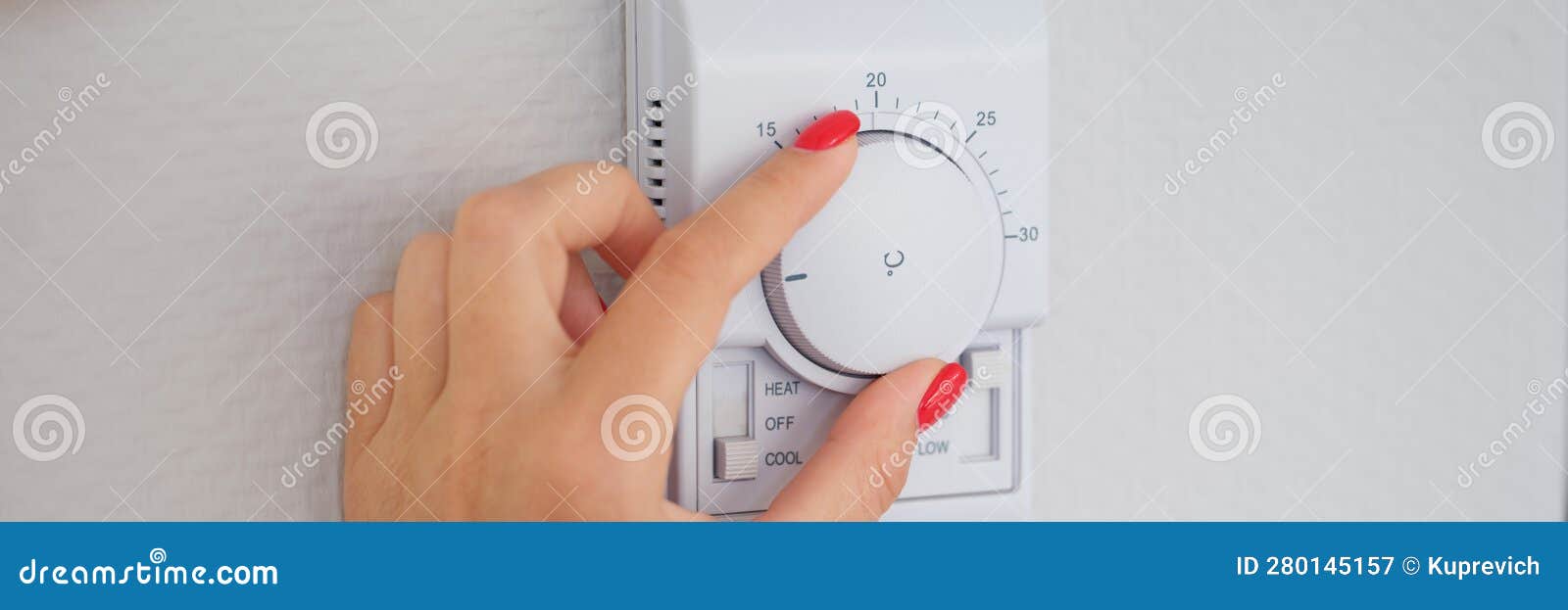 Woman Hand Adjusts or Turns on Wall Temperature Controller Controller ...