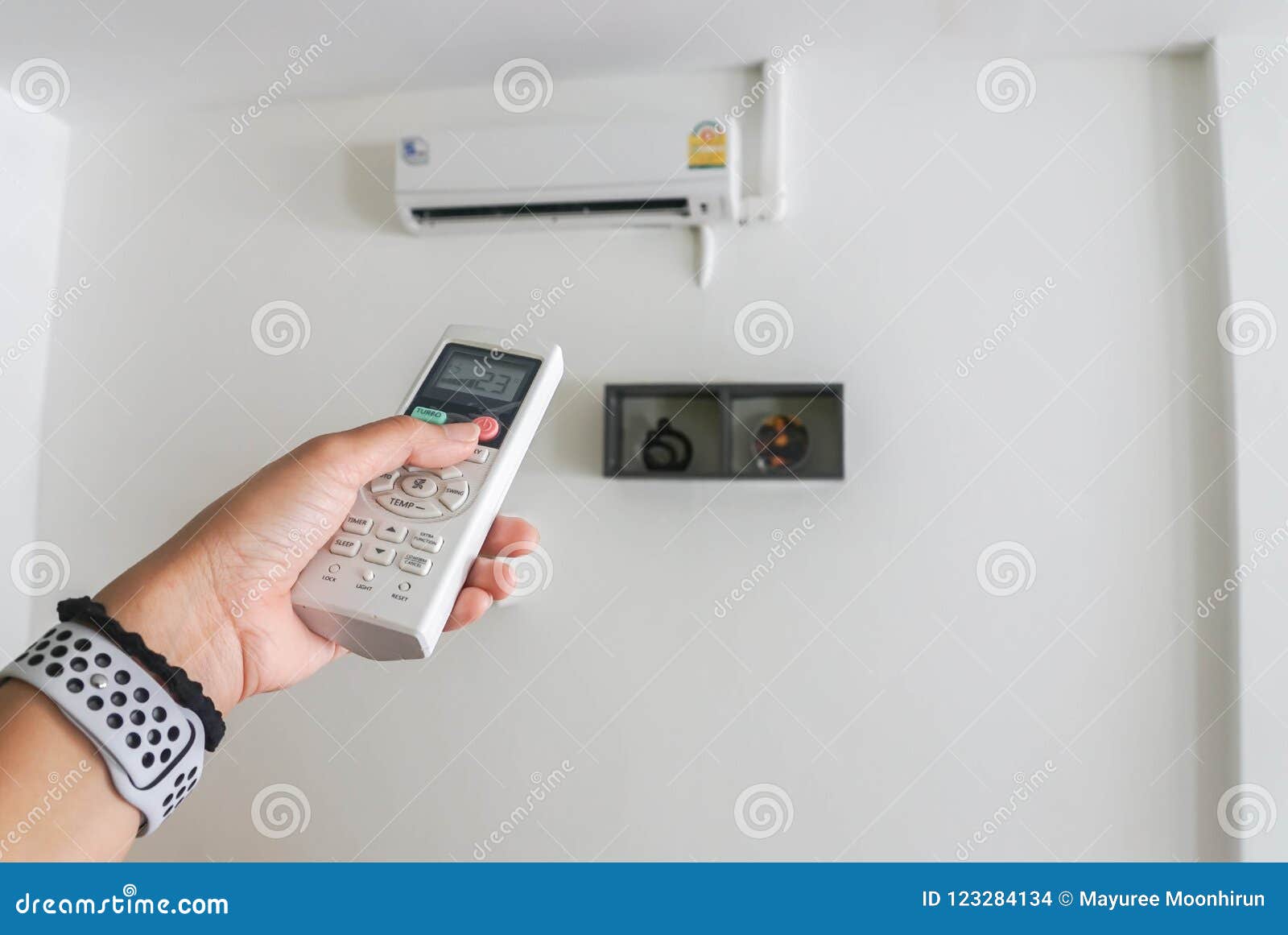 Woman Hand with Air Conditioner Remote Control Panel for Temperature ...