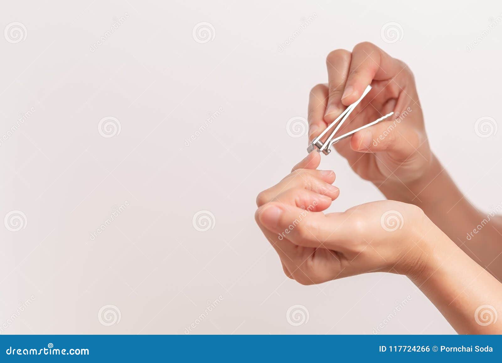 Woman Hand Cutting Nails Using Nail Clipper on White Backgrounds Stock ...