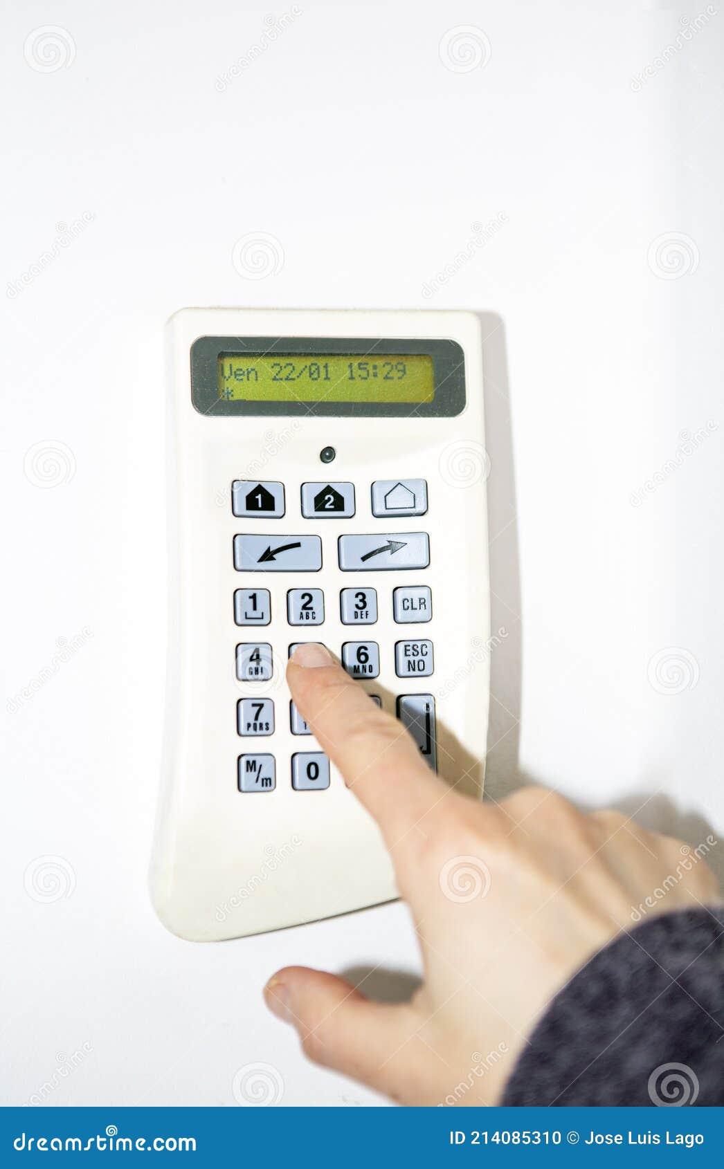 Woman Hand Entering Security Pin on Home Alarm Keypad. Home Security ...