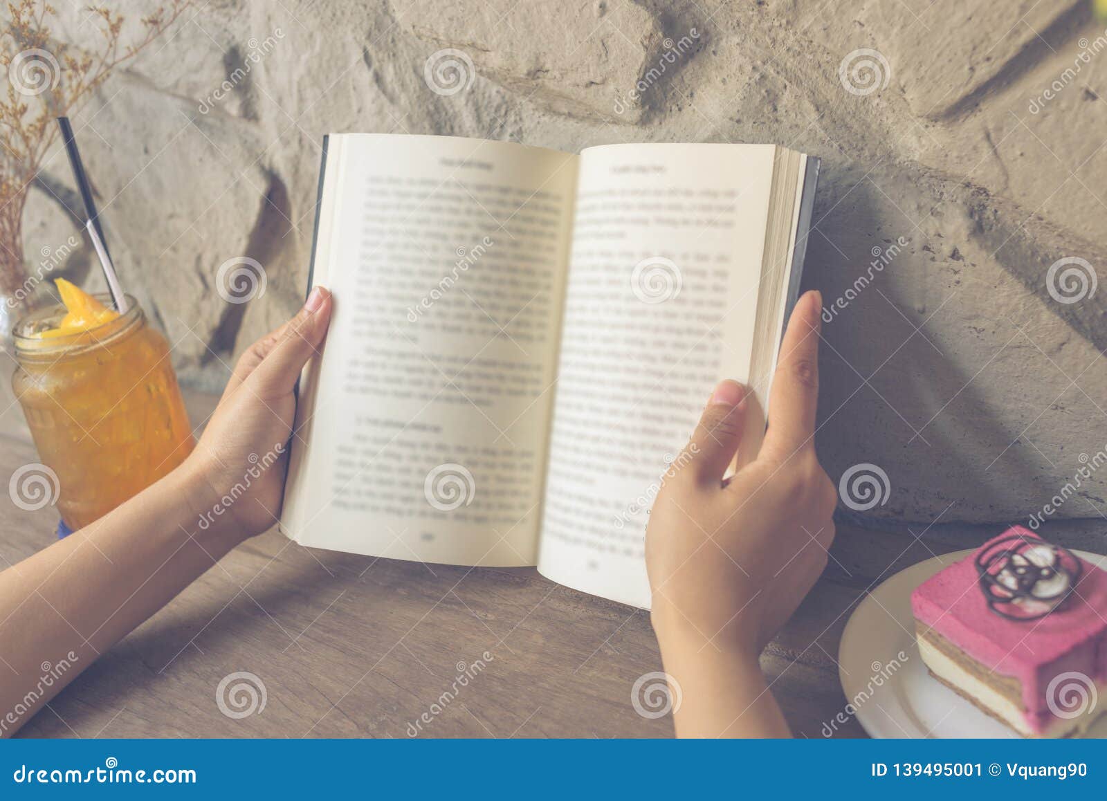 Woman Hand Holding and Reading Book Stock Image - Image of indoors ...