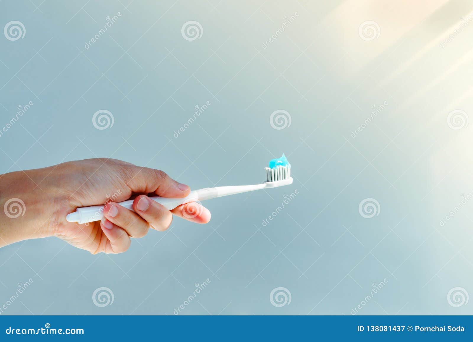 Woman Hand Holding Toothbrush with Toothpaste Applied on. Closeup of ...