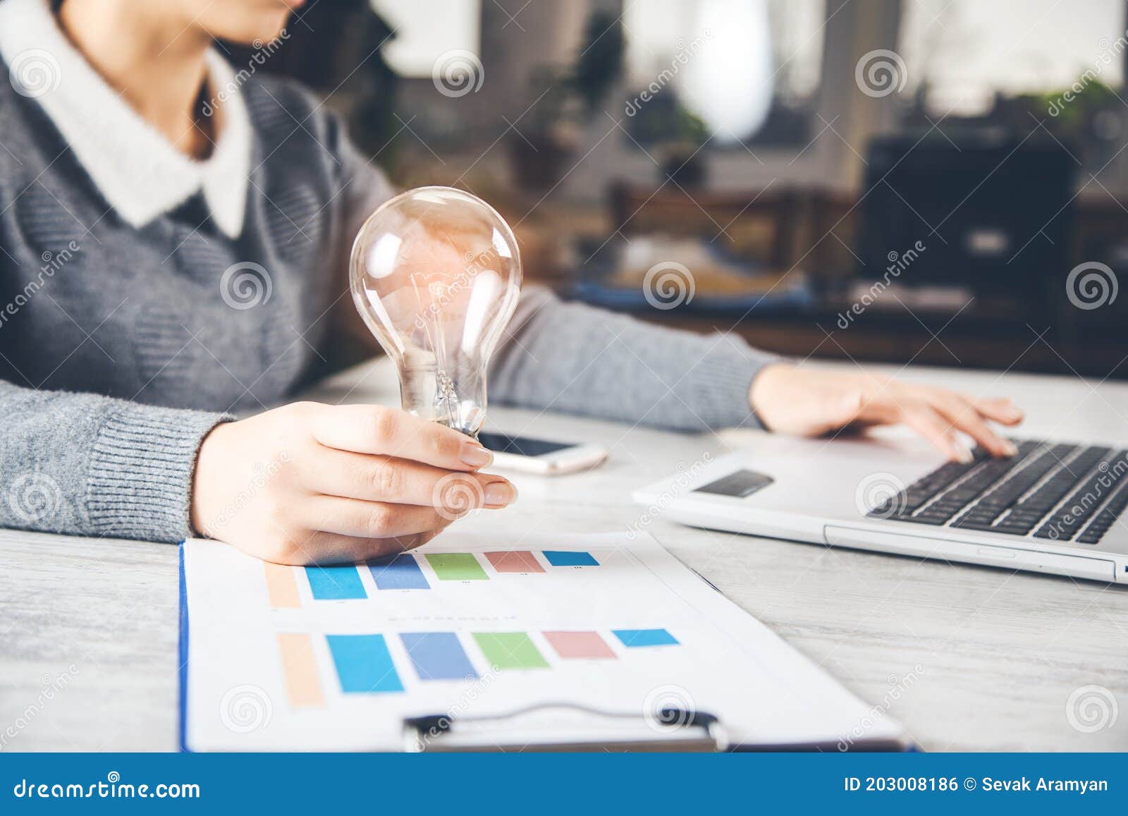 Woman Hand Light Bulb on Office Desk Stock Photo - Image of holding ...