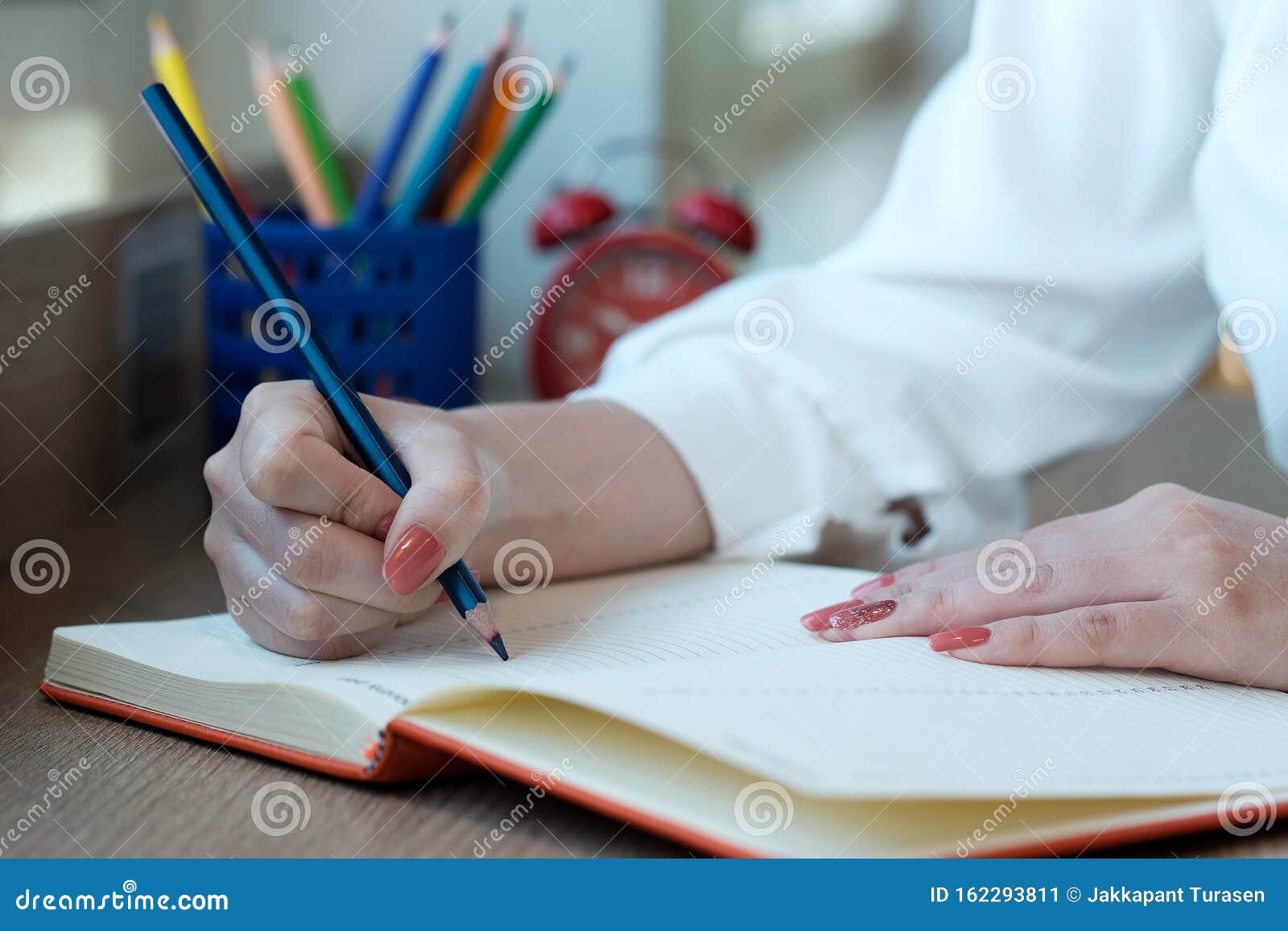 Woman Hand with Pencil Writing on Notebook. Making Notes in Notebook ...