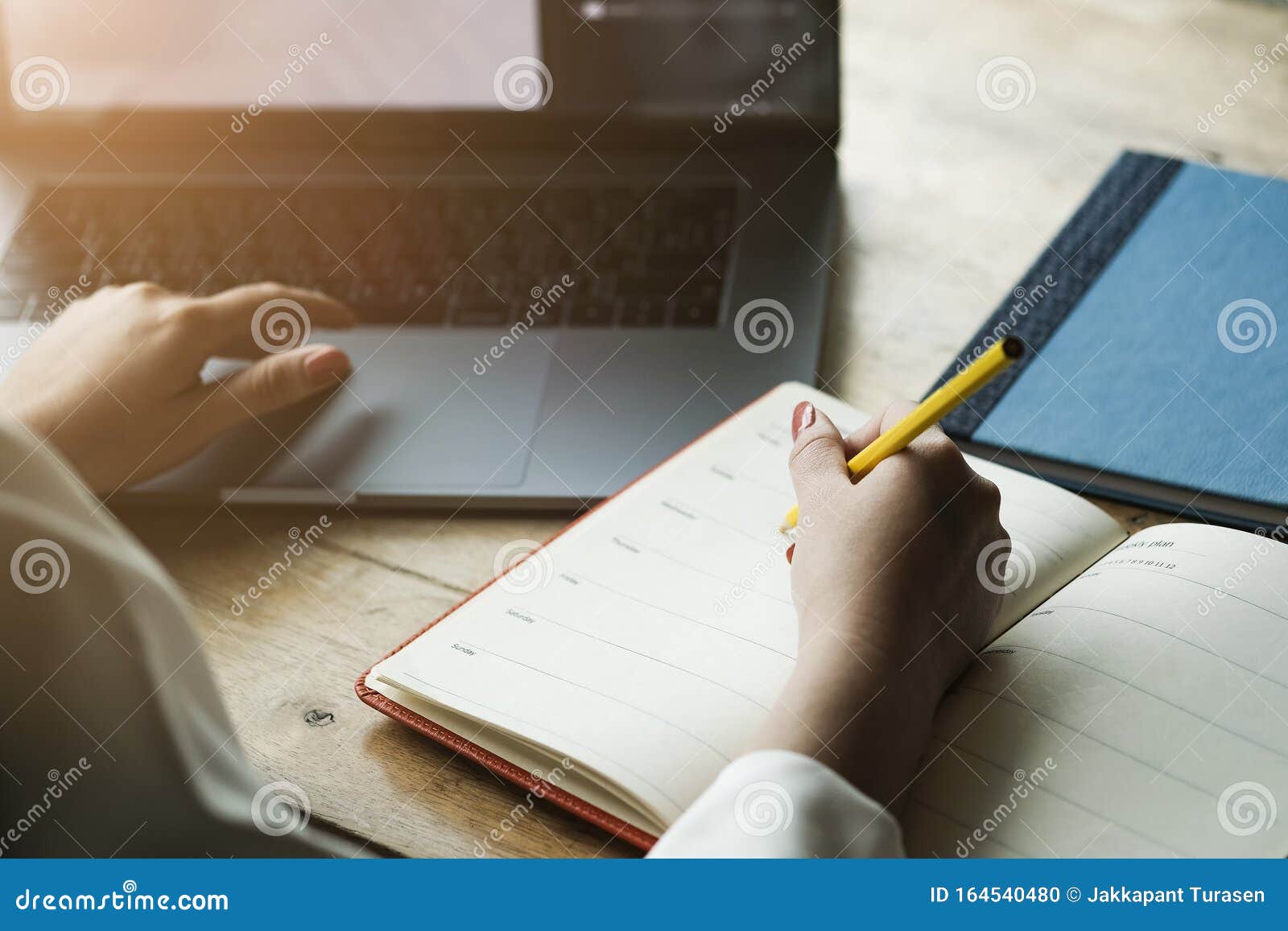 Woman Hand with Pencil Writing on Notebook. Making Notes in Notebook ...