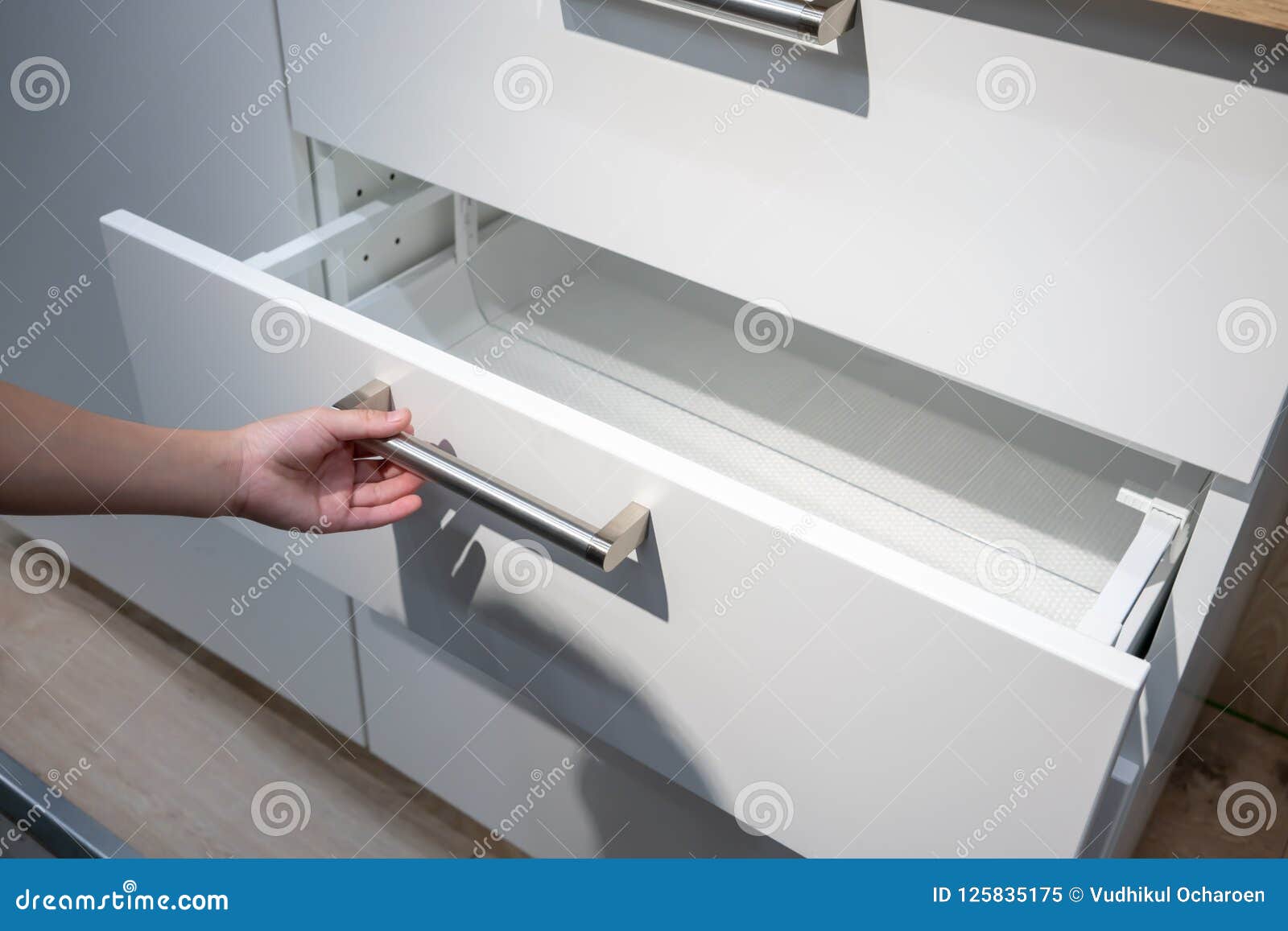 Woman Hand Pulling a Drawer Organized with Additional Plastic Stock ...