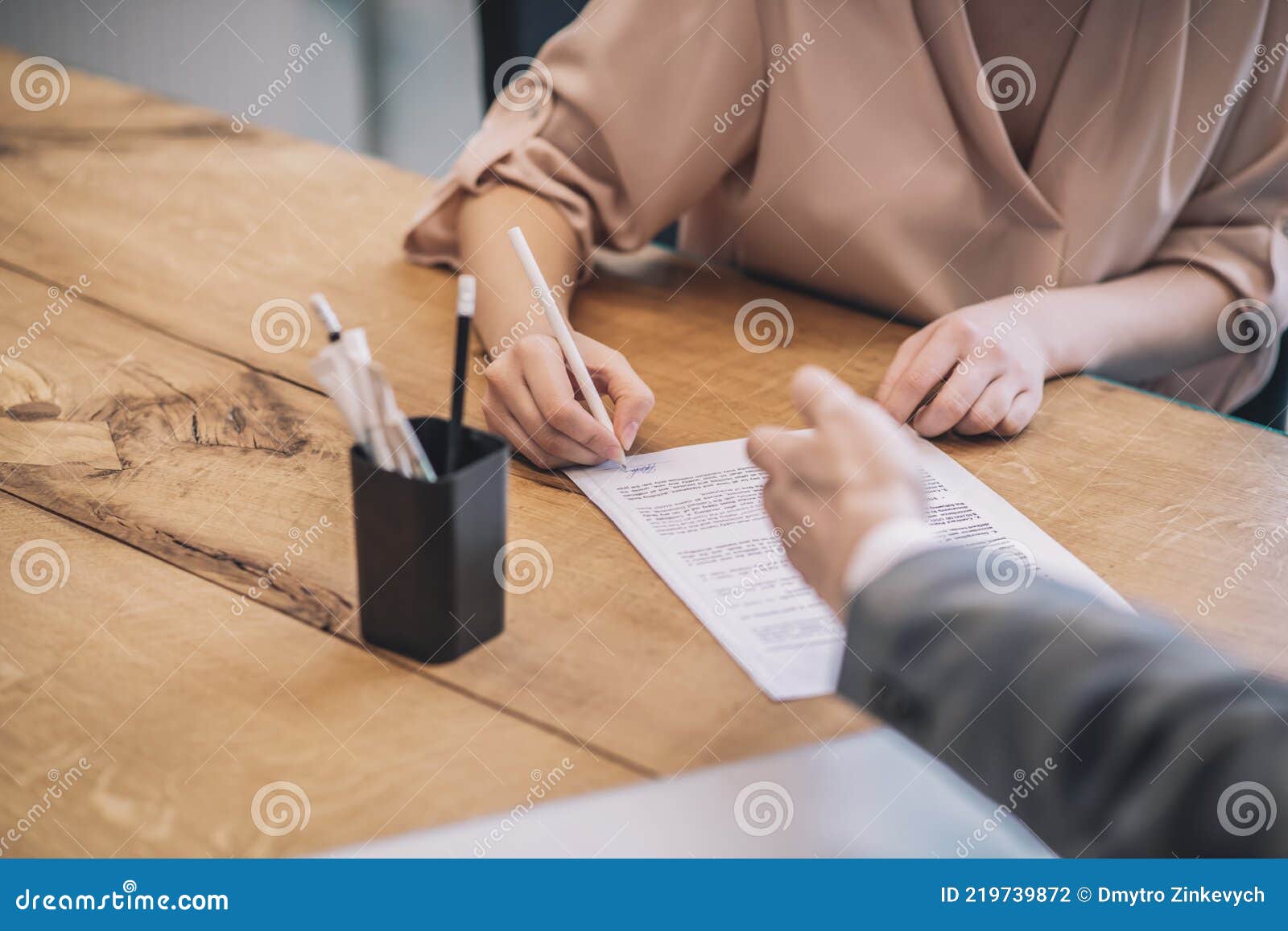 Woman Hand Signing Document and Male Pointing Stock Photo - Image of ...