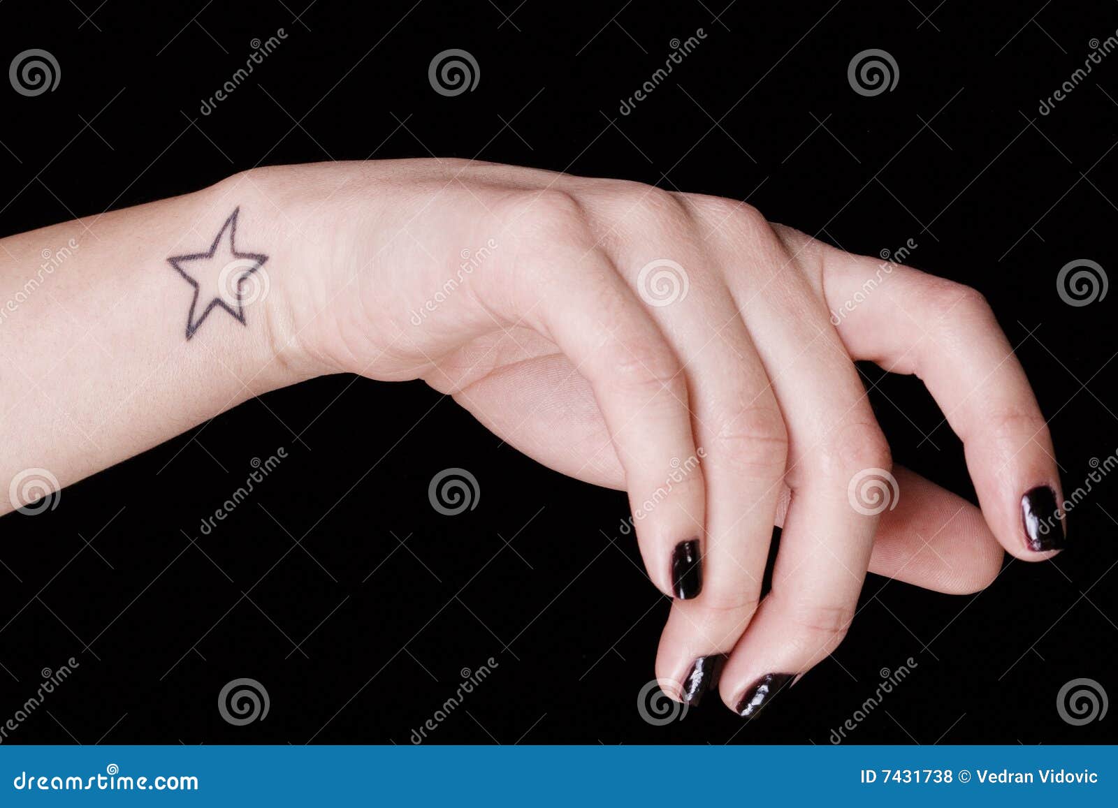 Woman hand with star tatoo stock photo. Image of nails - 7431738