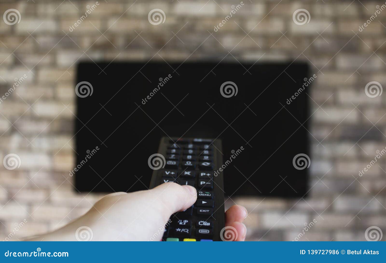 Woman Hand with a Television Remote Control and Presses the Button ...