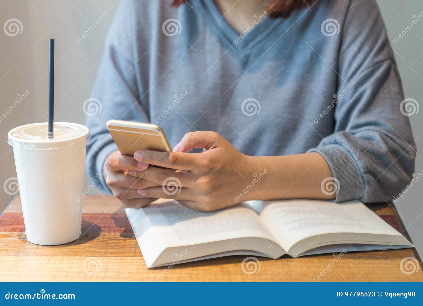 Woman Hand Texting Message, Reading Book in the Library Stock Image ...