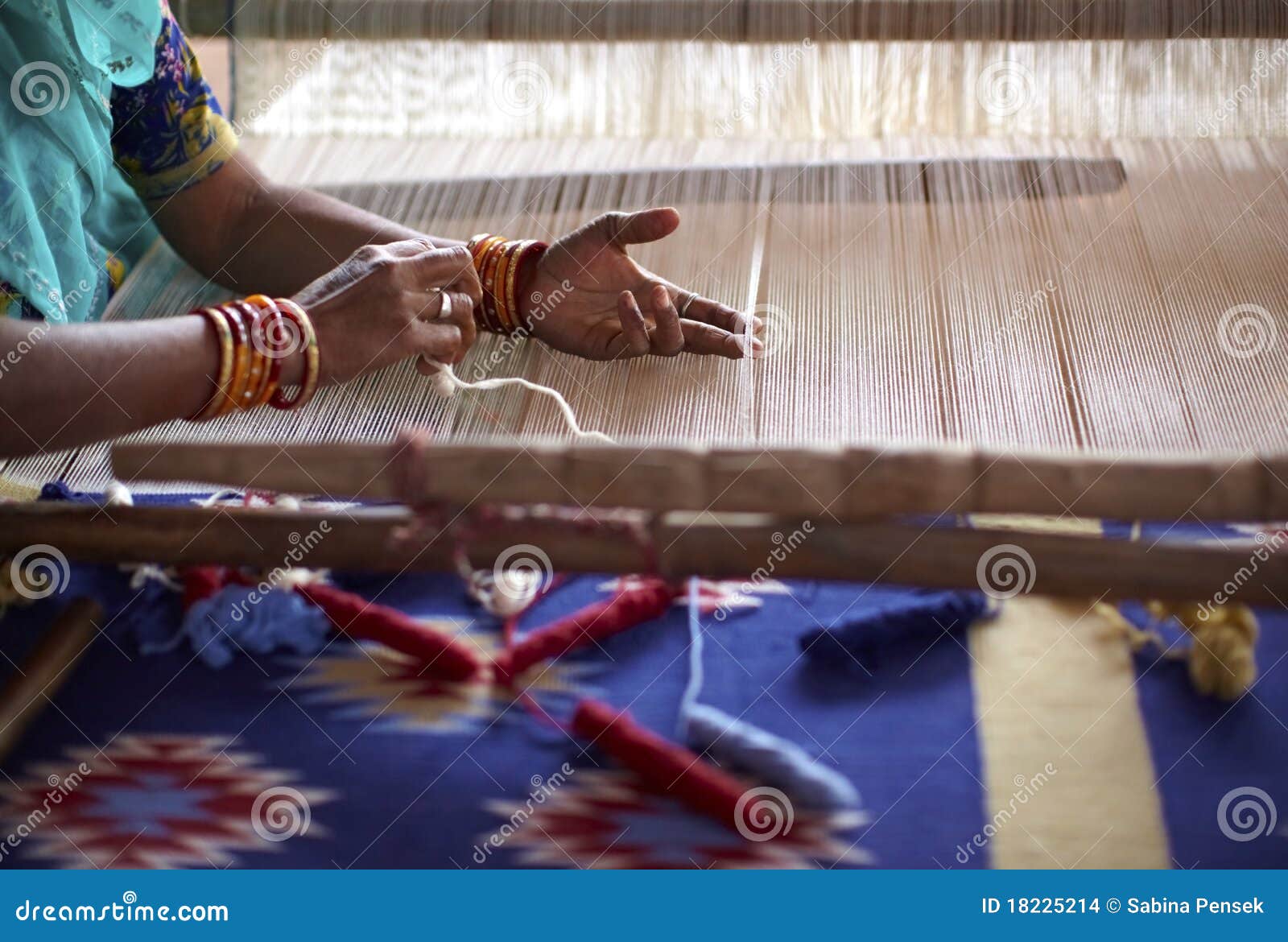 Woman Weaving Wicker In Traditional Way At Manual Loom. Stock ...
