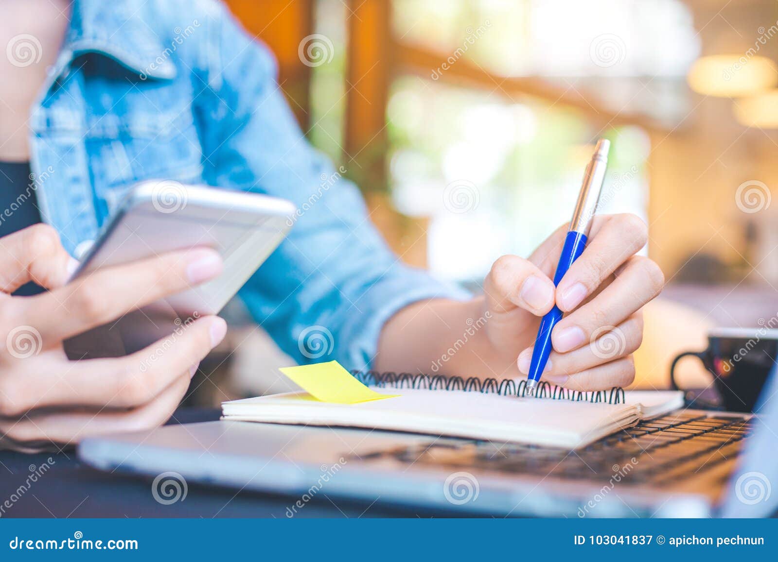 Woman Hand is Writing on a Note Pad with a Pen in the Office. Stock ...