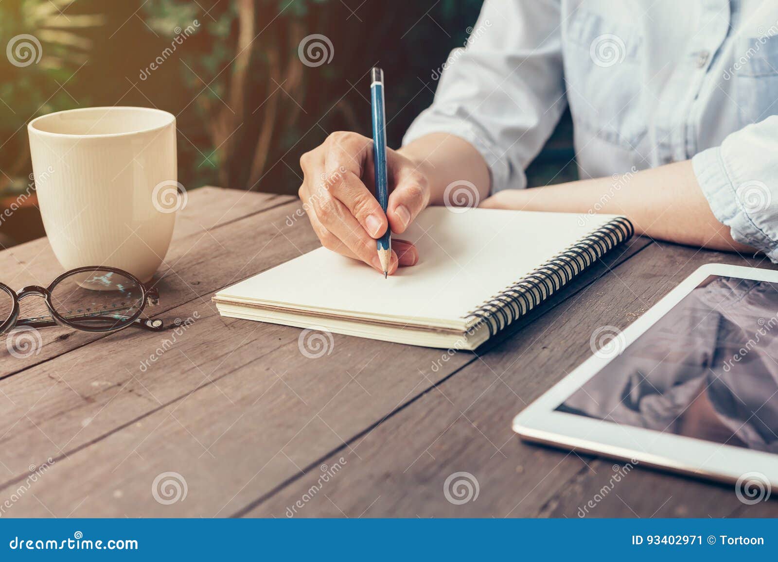 Woman Hand Writing Note Pad on Wood Table in Coffee Shop. Stock Image ...