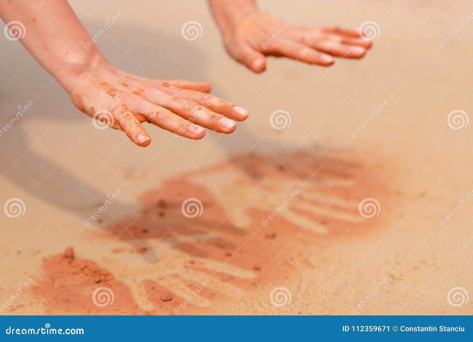 Woman Hands Creating Shapes with Red Sand on the Beach in Aboriginal ...