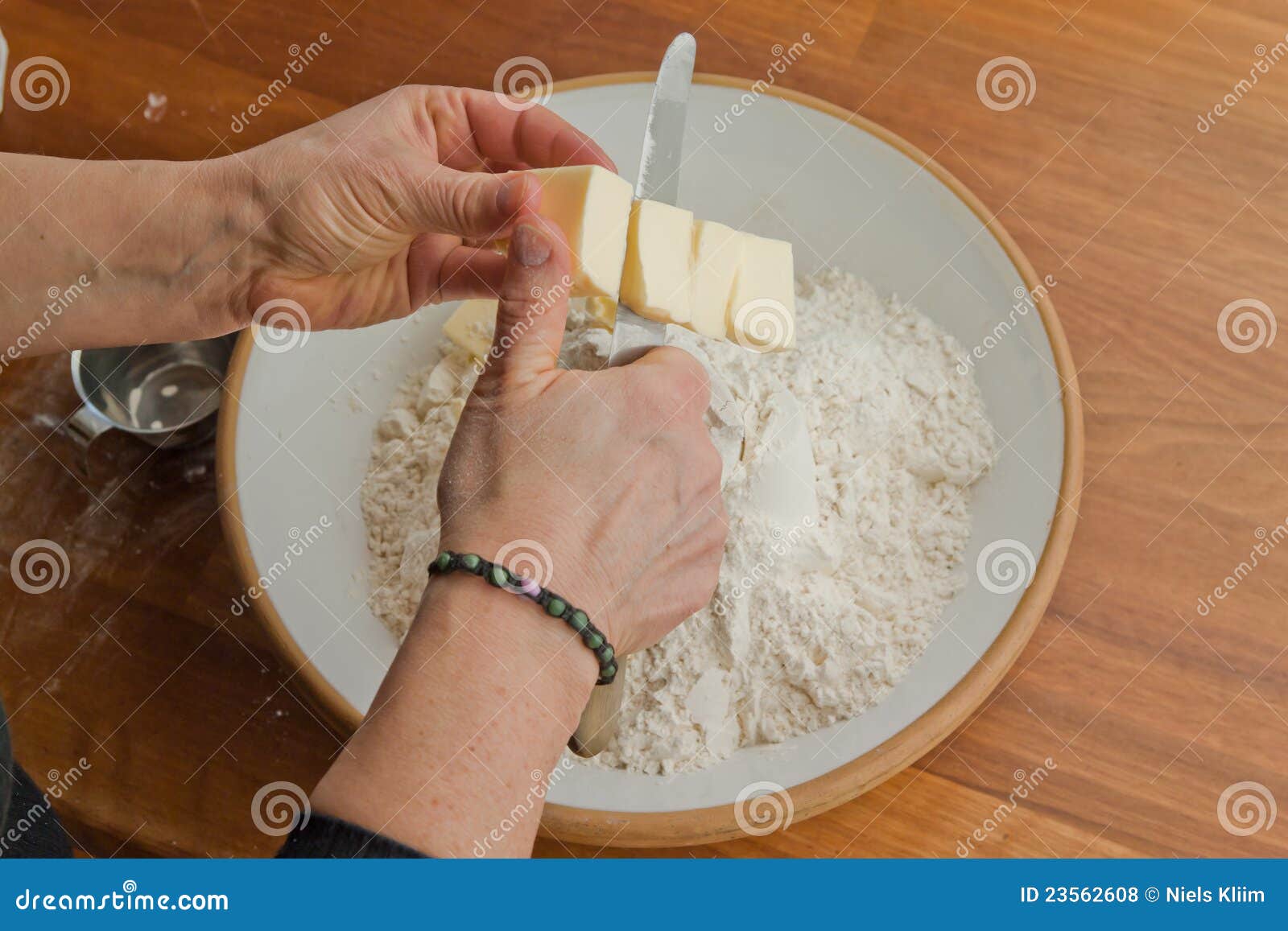 Woman hands cutting butter stock photo. Image of bowl - 23562608
