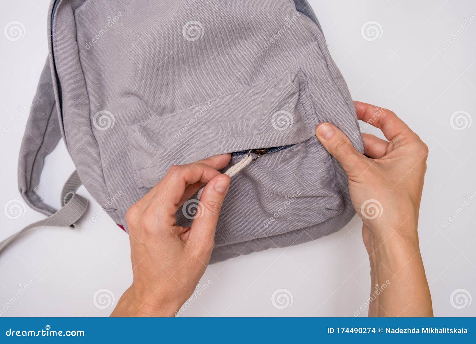 Woman Hands Packing, Zipping the Zipper Lock on a Backpack Stock Photo ...