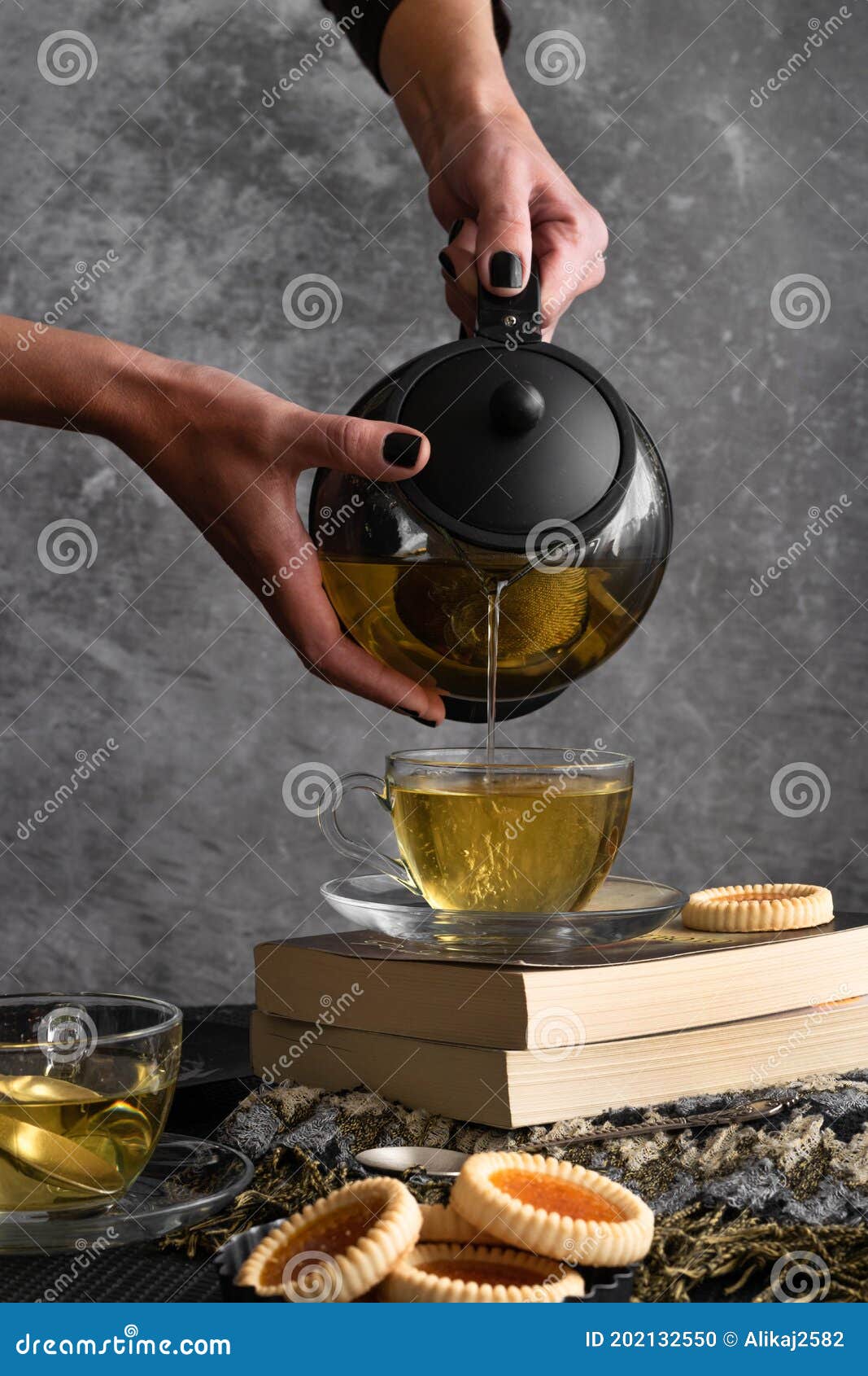 Woman Hands Pouring Tea from a Teapot Stock Photo - Image of dark ...