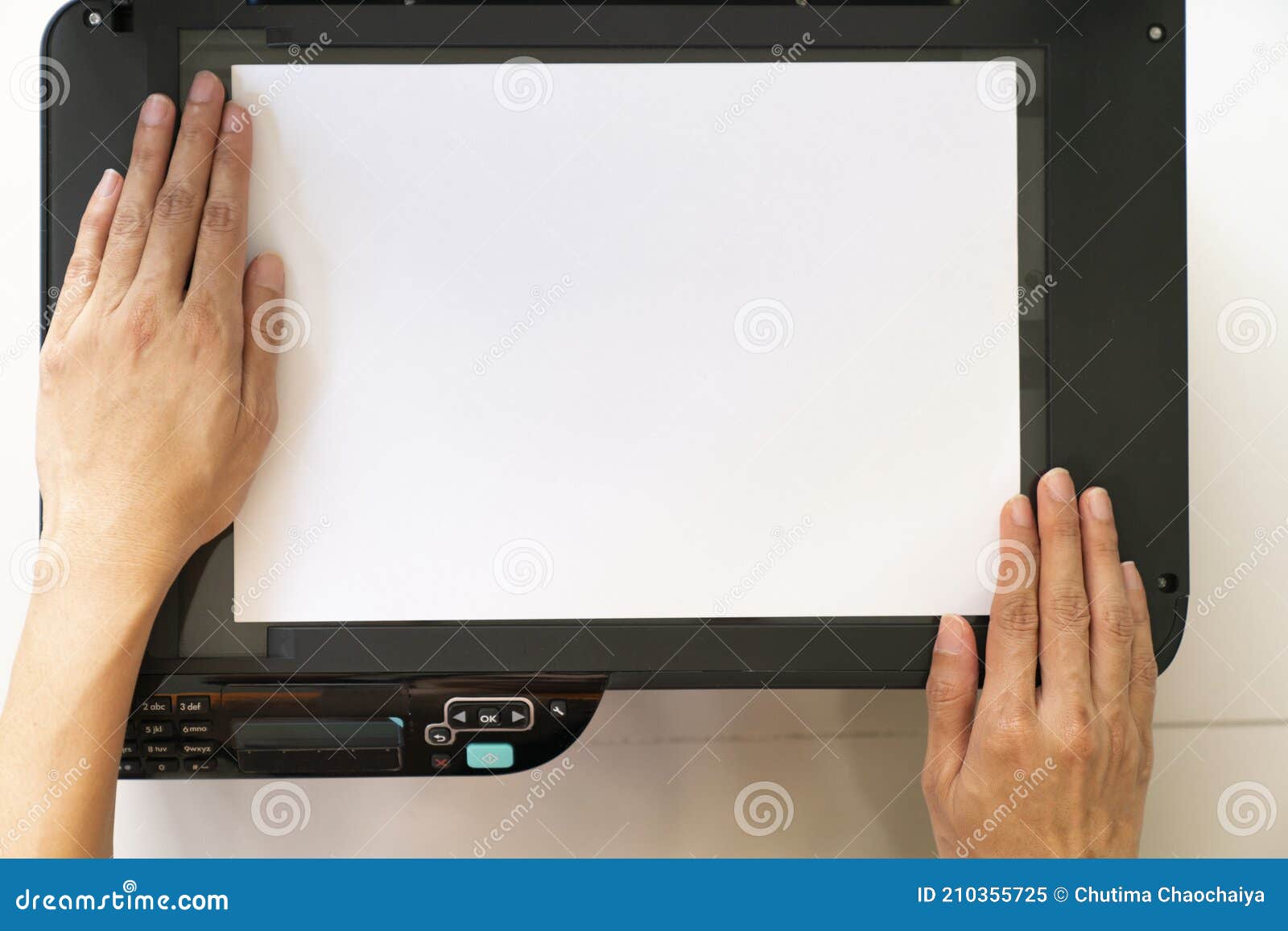 Woman Hands Putting a Sheet of Paper into a Copying Device or Printer ...