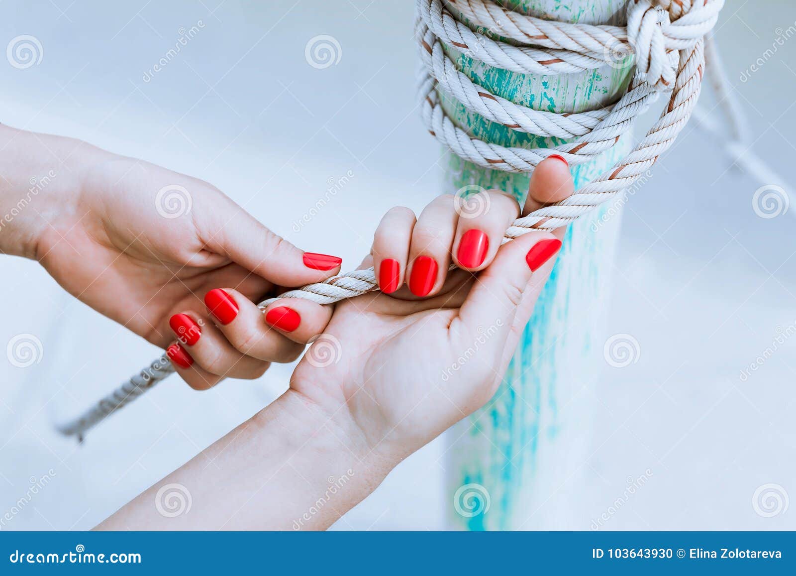 Woman Hands with Red Manicure Holding Rope Outdoors Stock Photo - Image ...