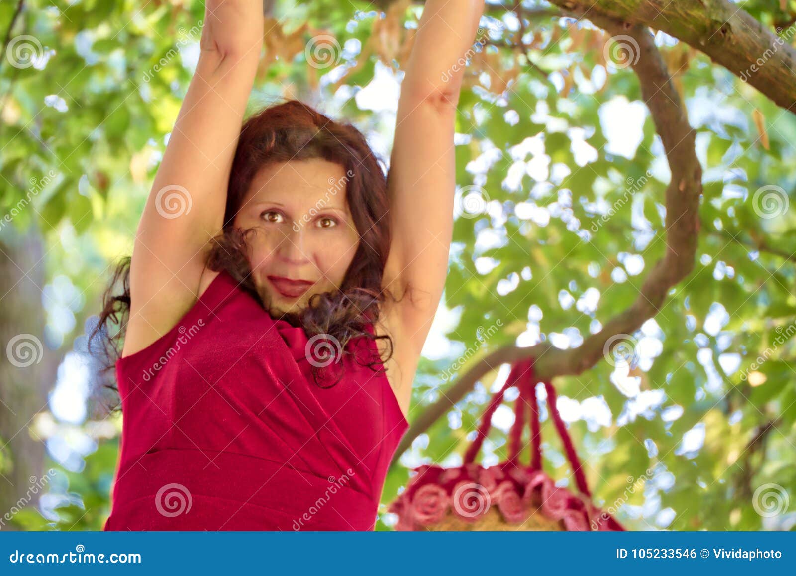 Woman hanging from tree stock photo. Image of happy - 105233546