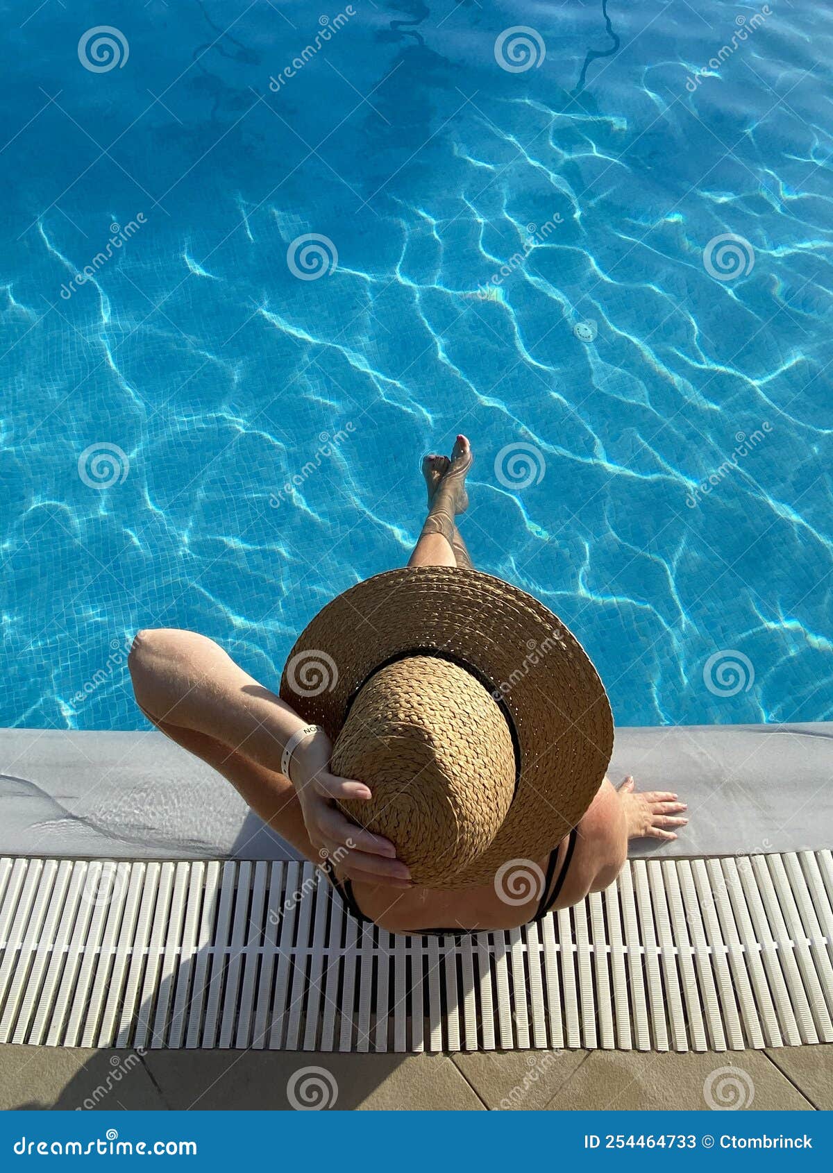 Woman with hat at the pool stock image. Image of vacation - 254464733