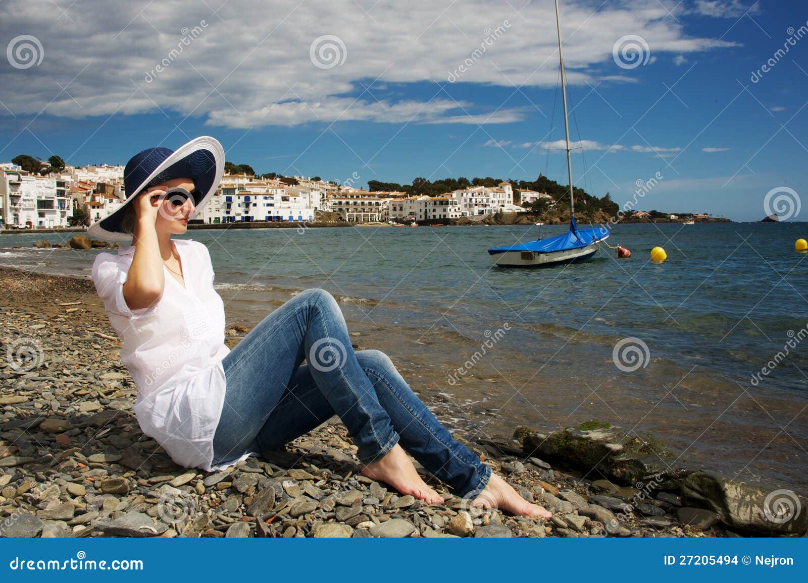 Woman in Hat Sitting on a Beach Stock Photo - Image of happiness, jeans ...