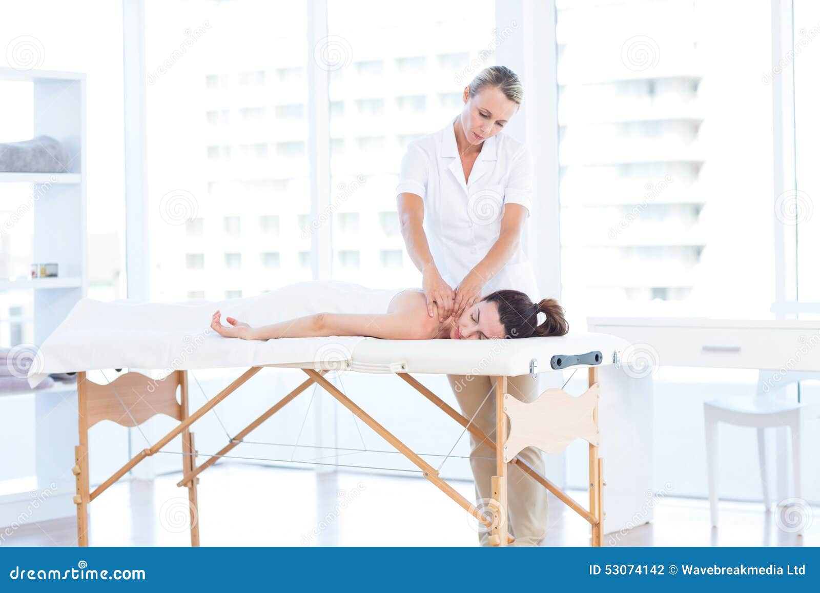 Woman having back massage stock photo. Image of health - 53074142