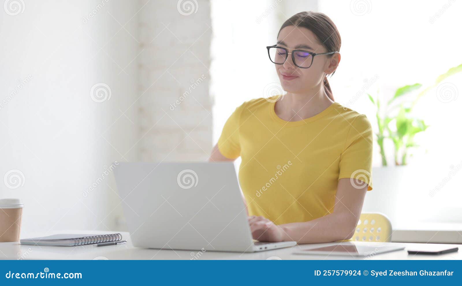 Woman Having Back Pain while Using Laptop in Office Stock Photo - Image ...