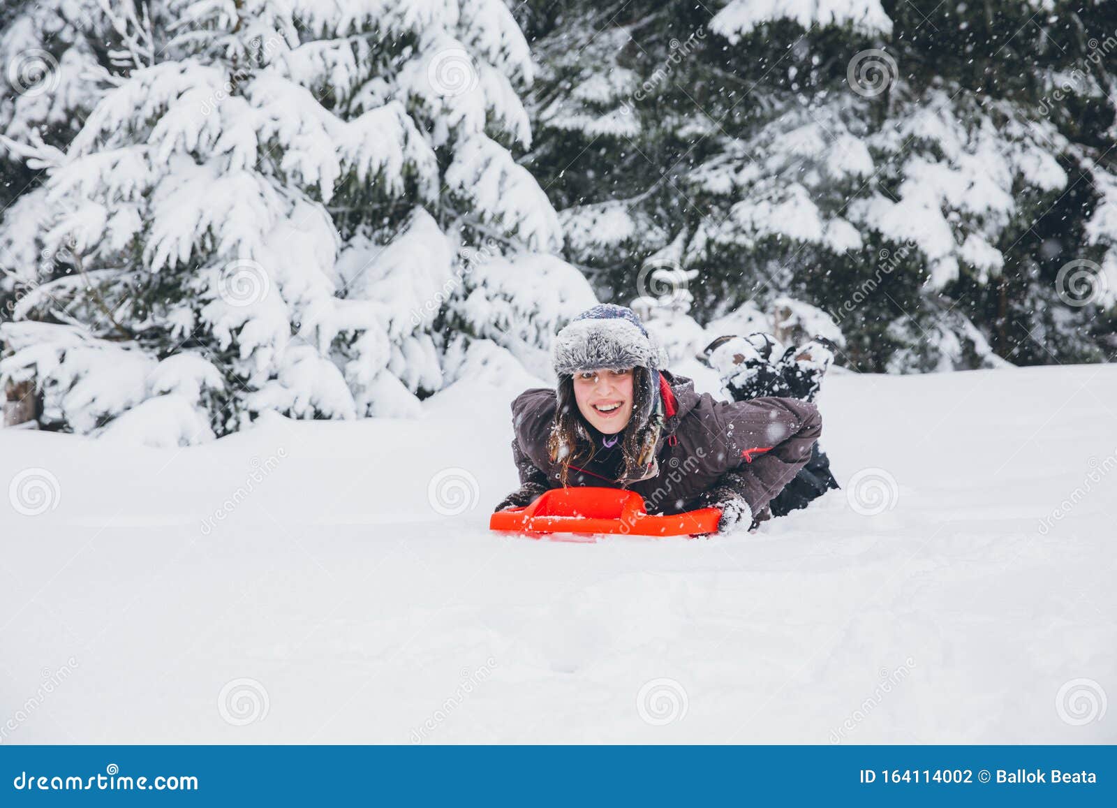 Woman Having Fun in Heavy Snow with a Sleigh Stock Photo - Image of ...
