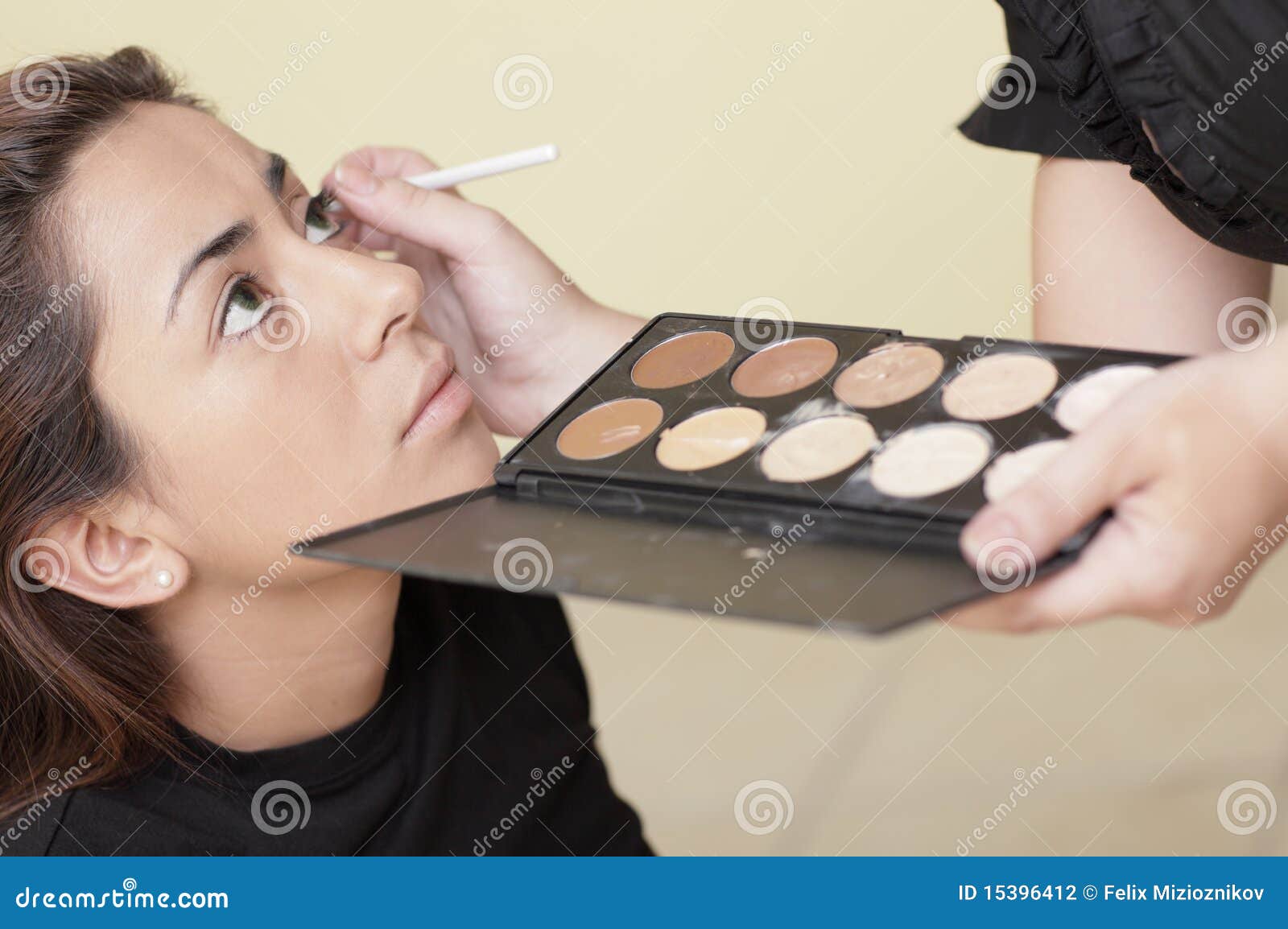Woman Having Makeup Applied Stock Photo - Image of hispanic, female ...