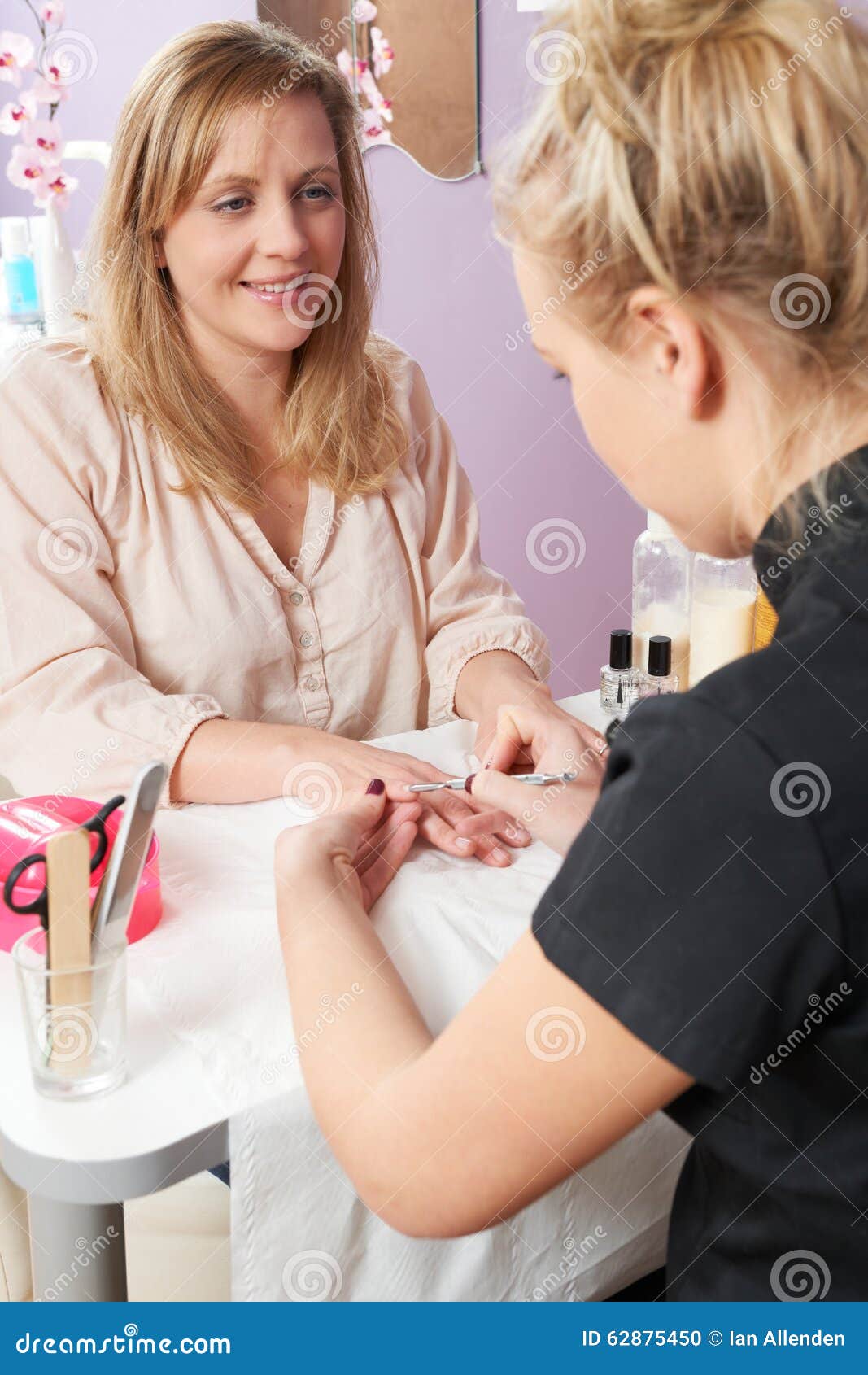 Woman Having Manicure at Beauty Salon Stock Photo - Image of beauty ...