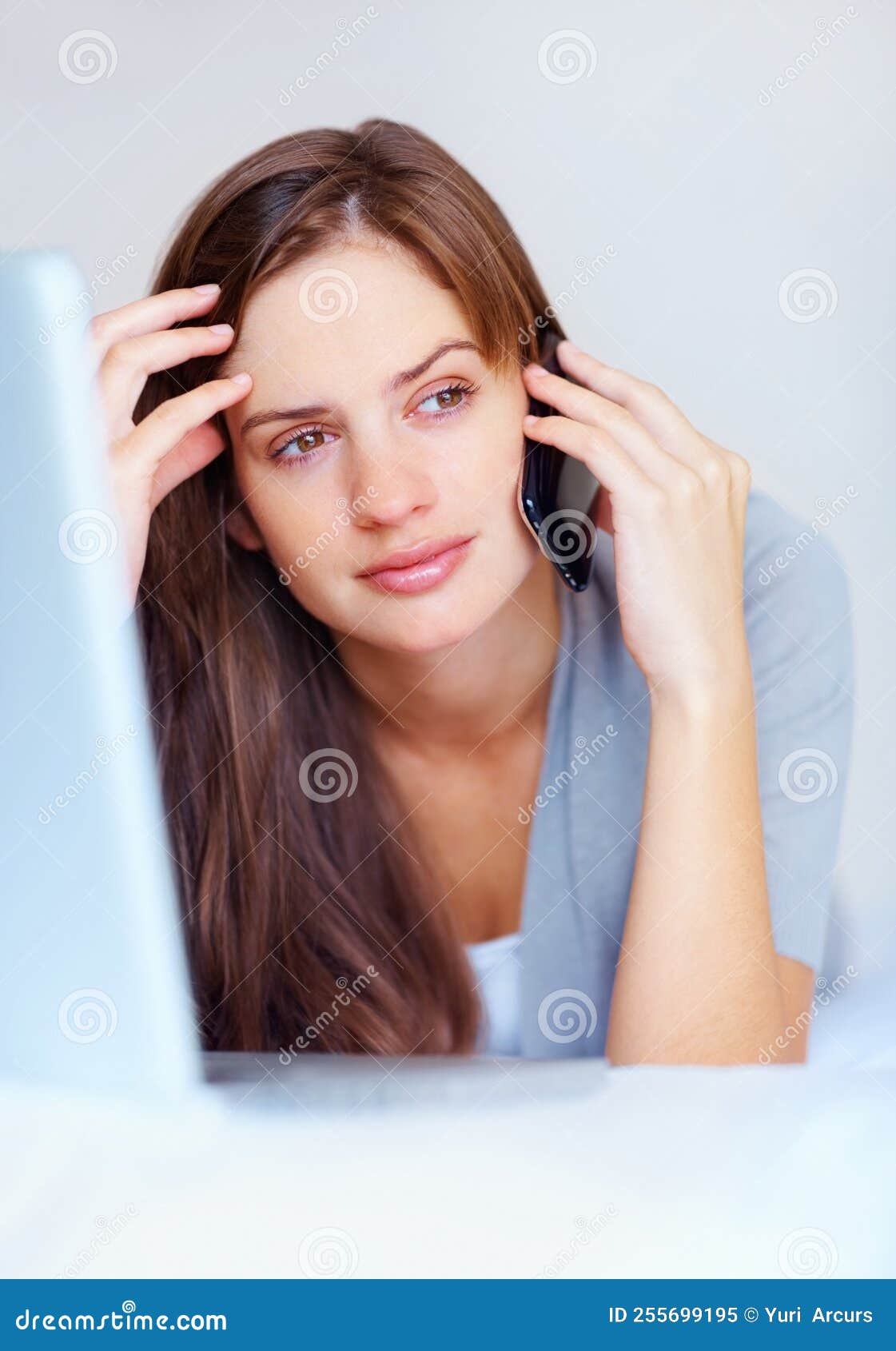 Woman Having a Serious Conversation Over Cellphone on Bed. Young ... Woman Having a Serious Conversation Over Cellphone on Bed. Young ...