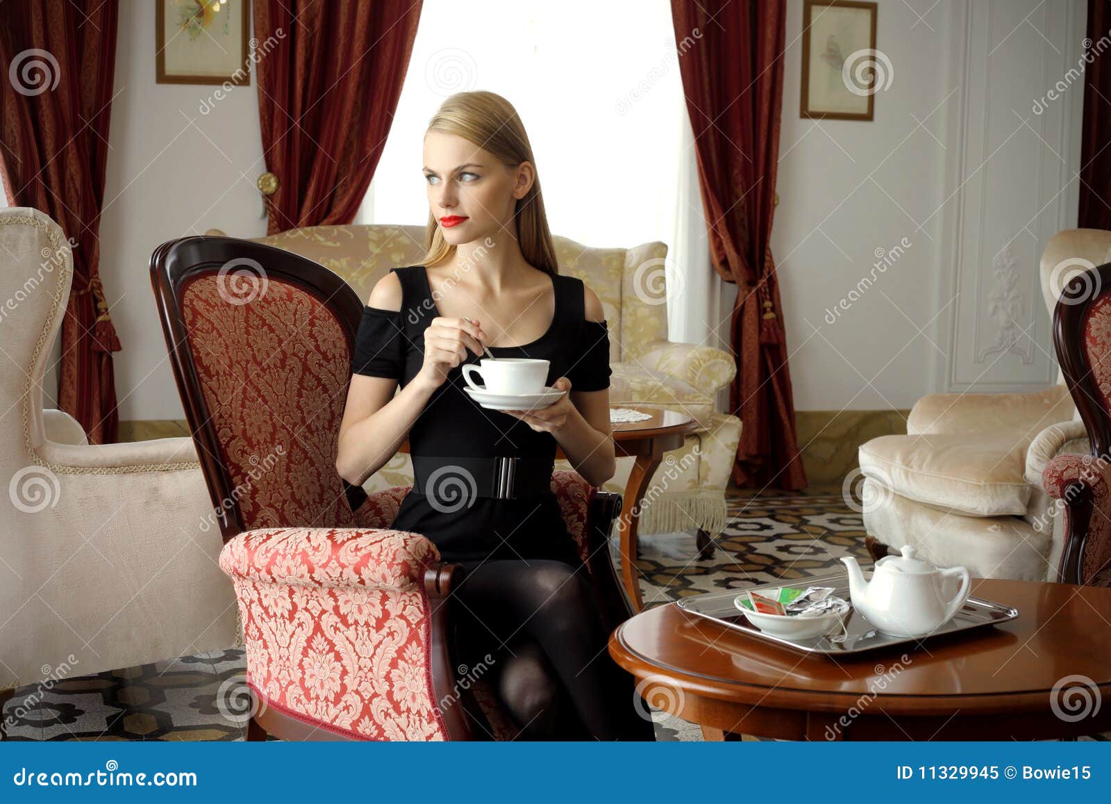 Woman having tea stock image. Image of beautiful, young - 11329945
