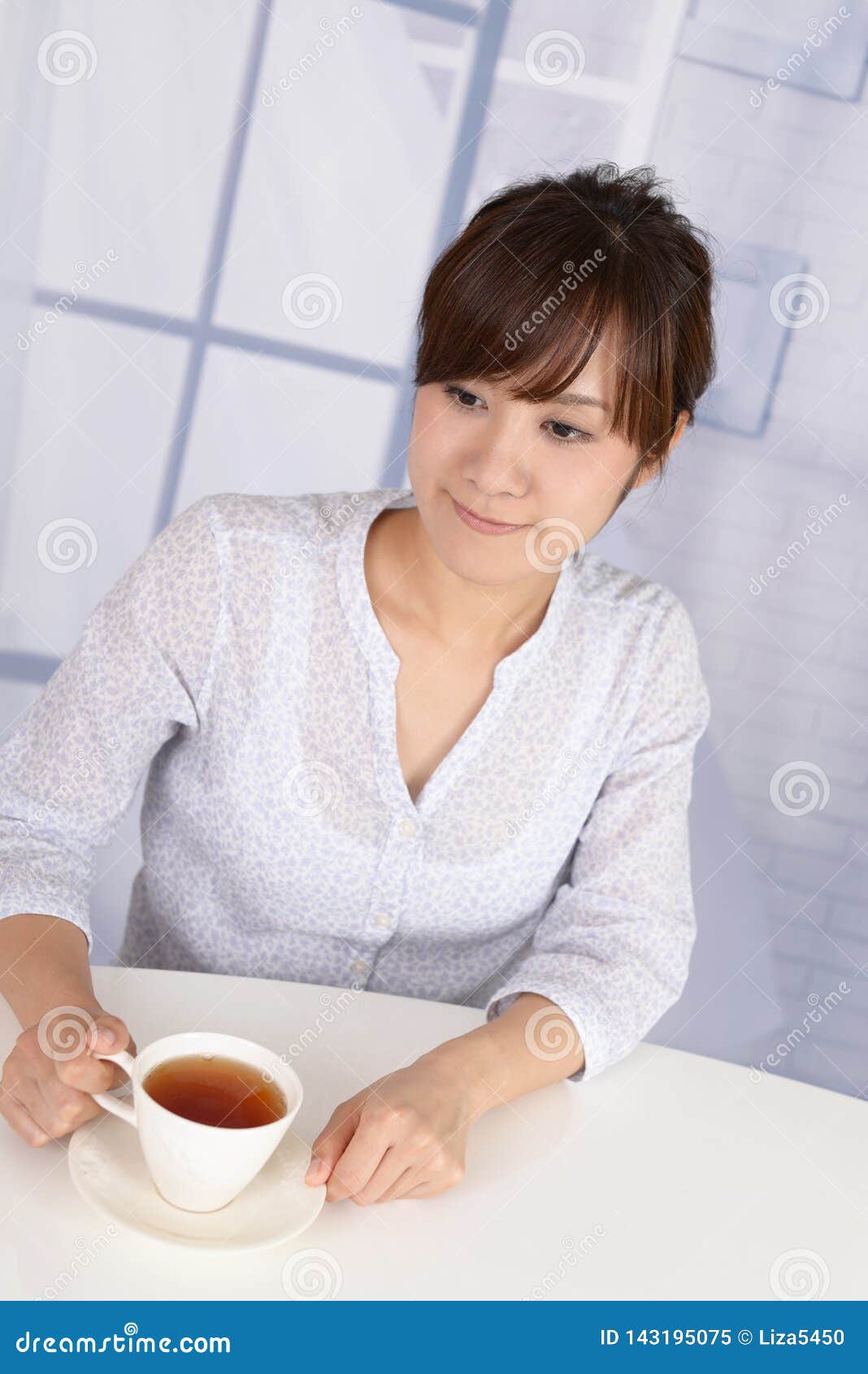 Woman having tea stock image. Image of ease, holiday - 143195075