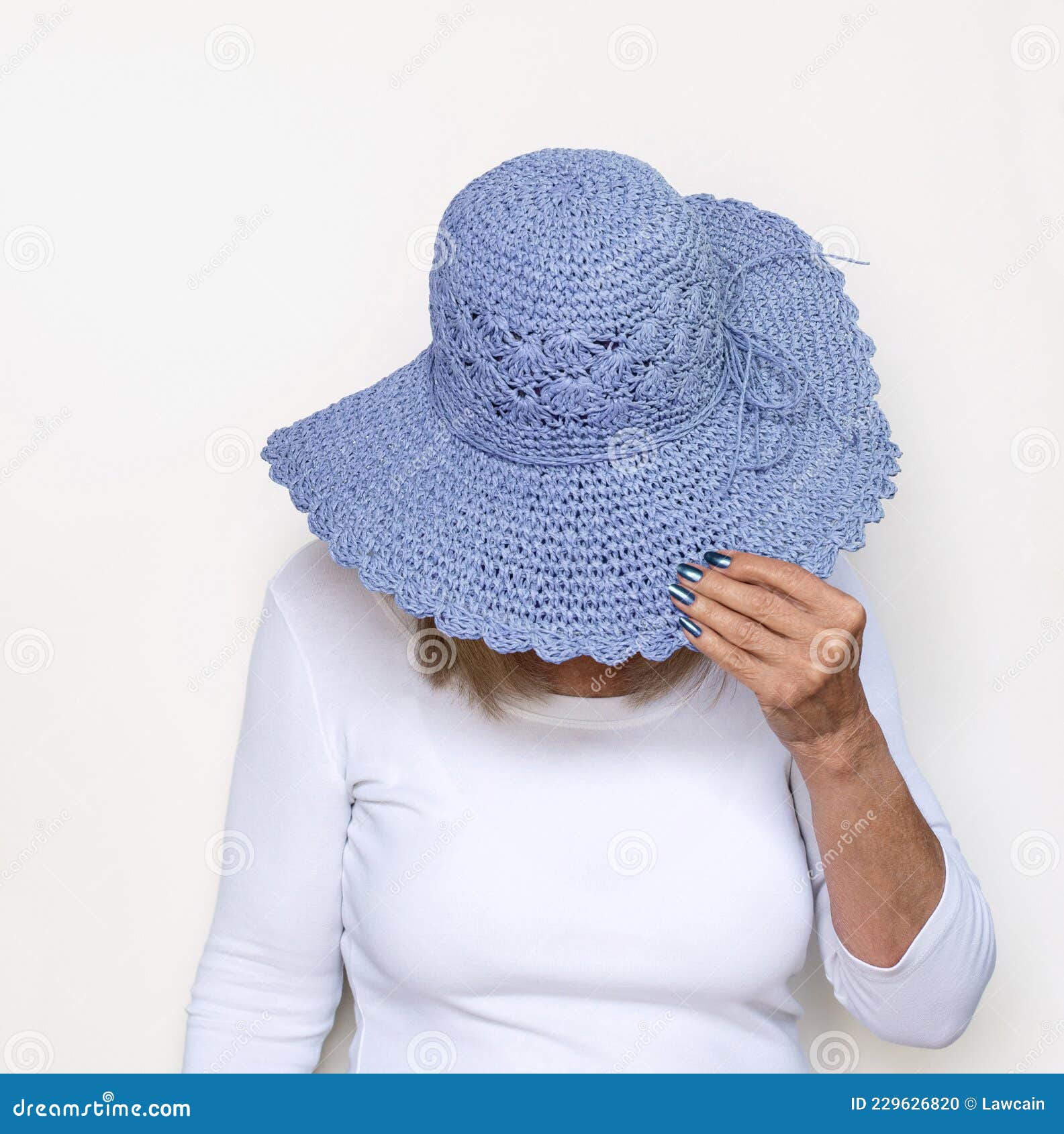 Woman with Head Down Holding Blue Straw Hat Stock Photo - Image of ...