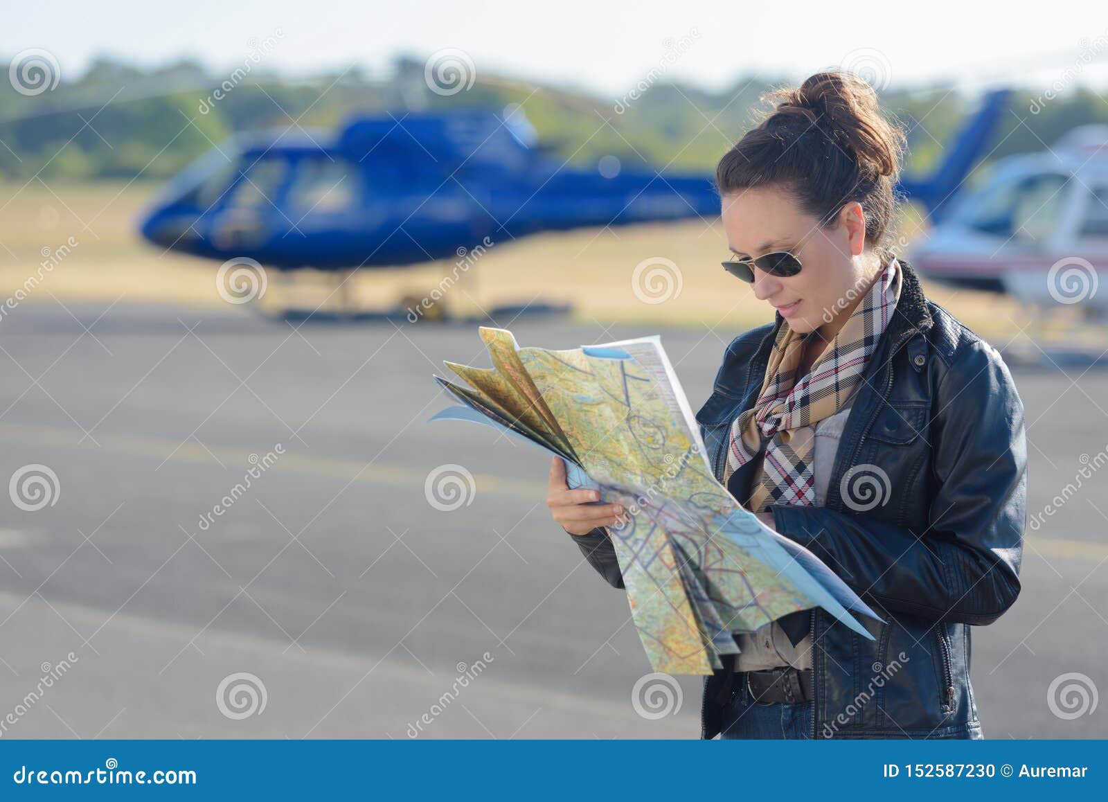 Woman Helicopter Pilot Reading Map Stock Photo - Image of concentration ...