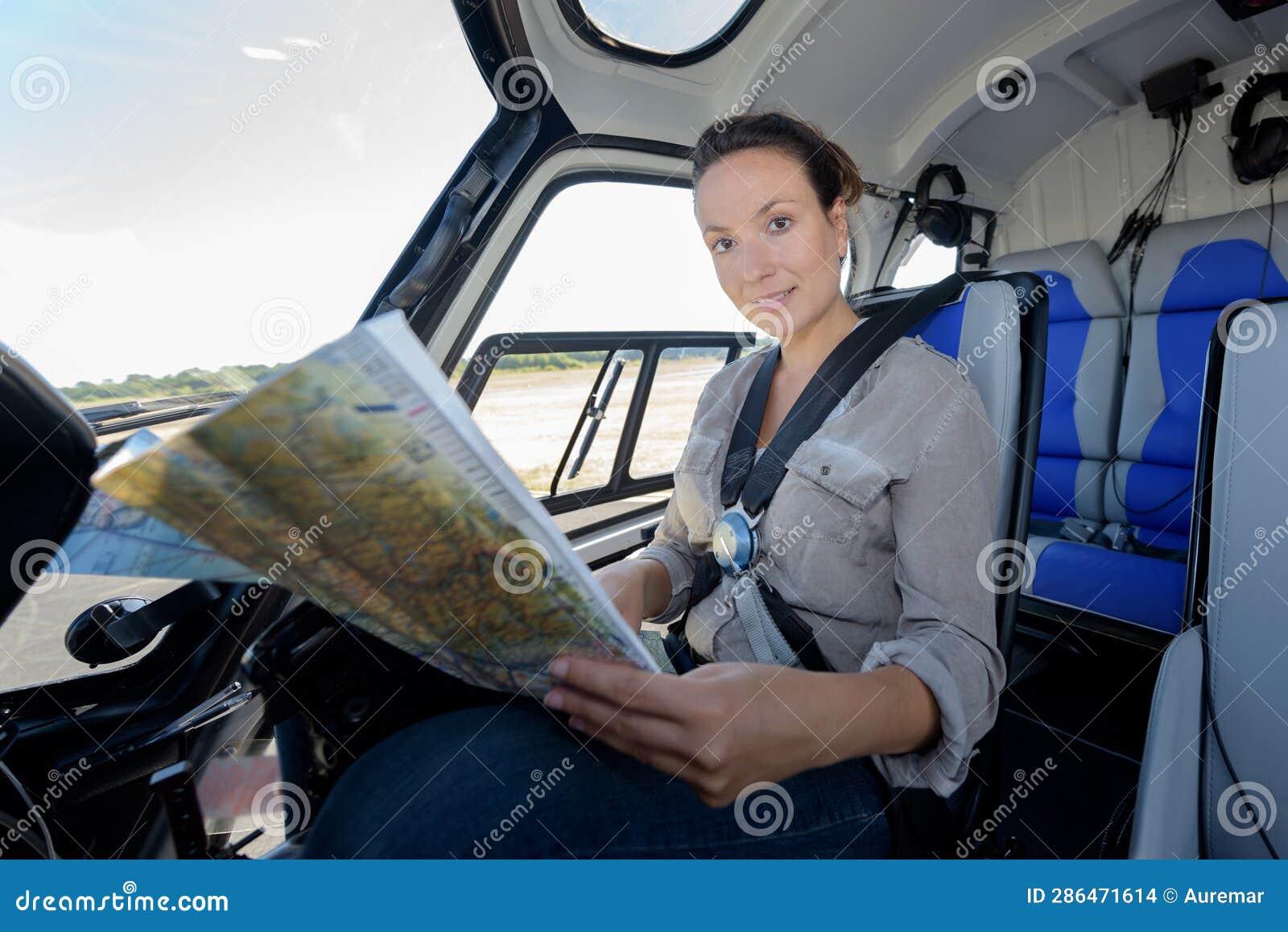 Woman Helicopter Pilot Reading Map Stock Photo - Image of girl ...
