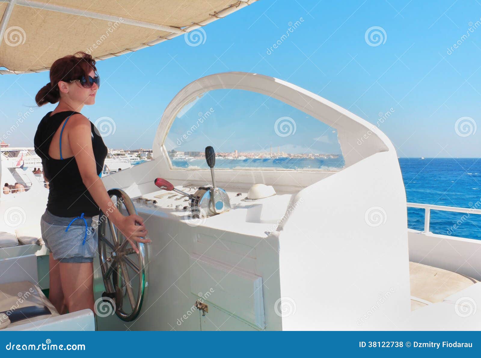Woman at Helm of Yacht Captain Stock Photo - Image of boat, bikini ...