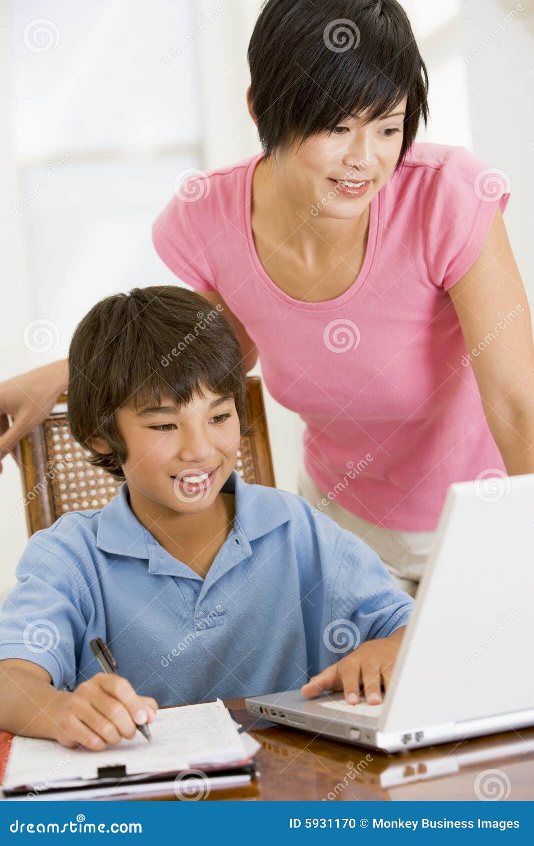 Woman Helping Boy with Laptop Doing Homework Stock Photo - Image of ...