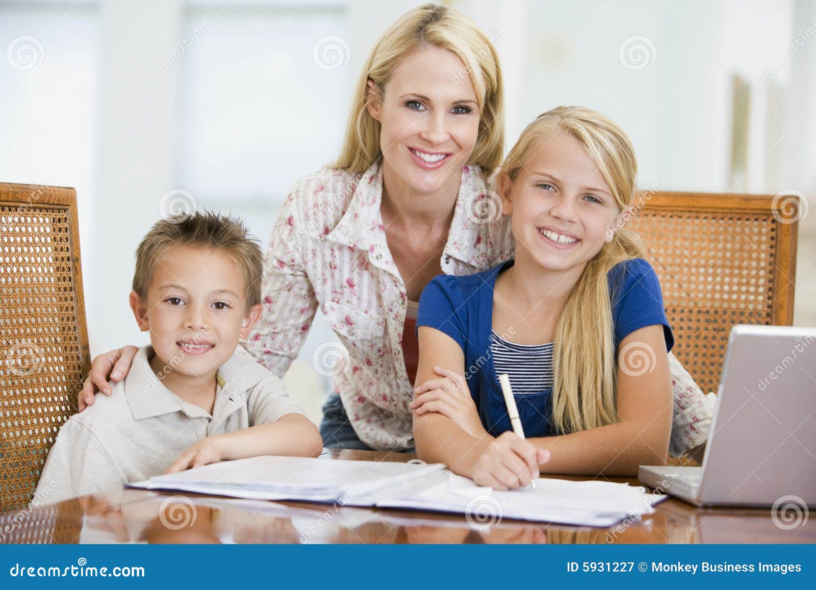 Woman Helping Children with Laptop Doing Homework Stock Image - Image ...