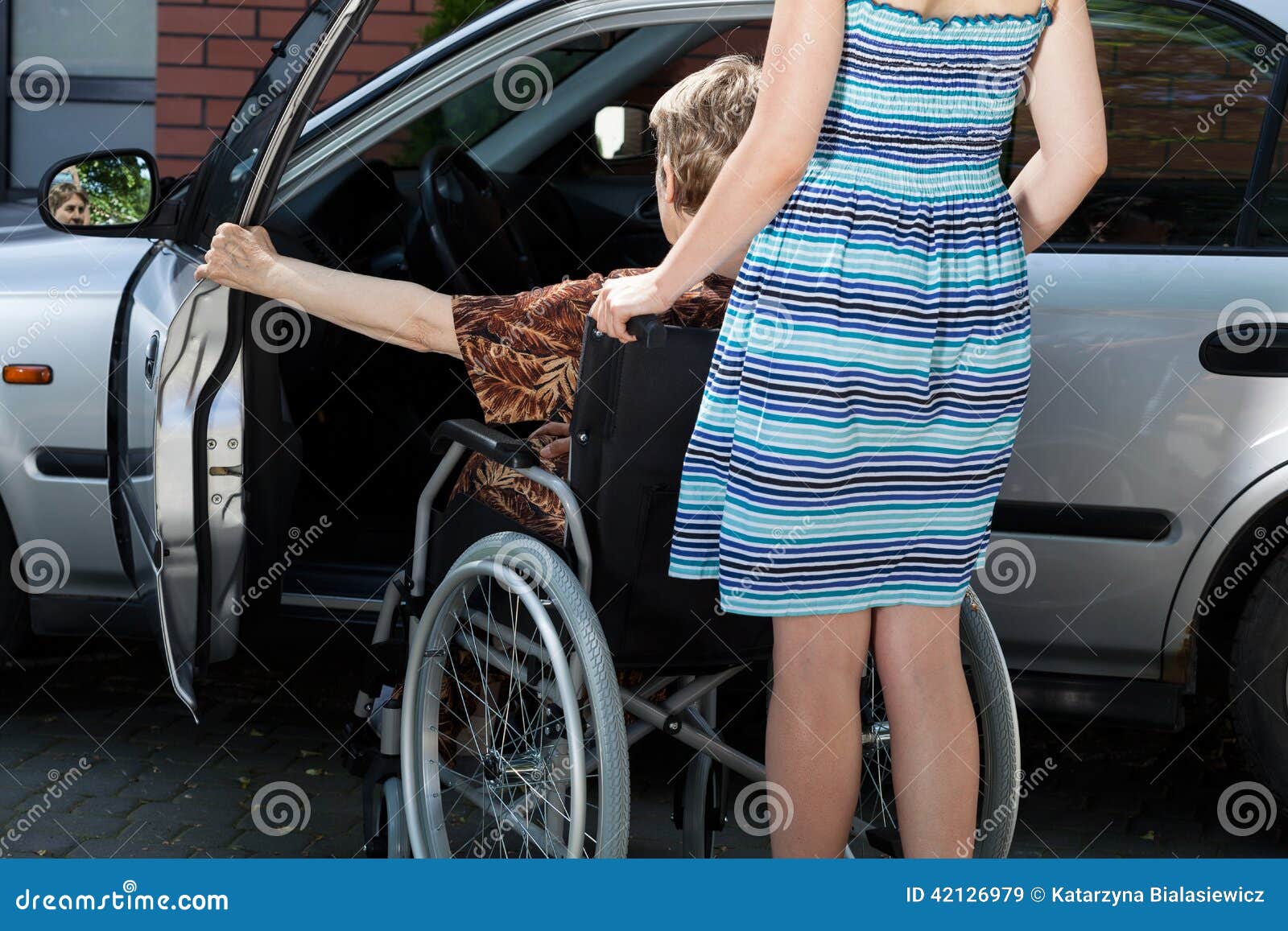 Woman Helping Disabled Get into Car Stock Image - Image of driving ...