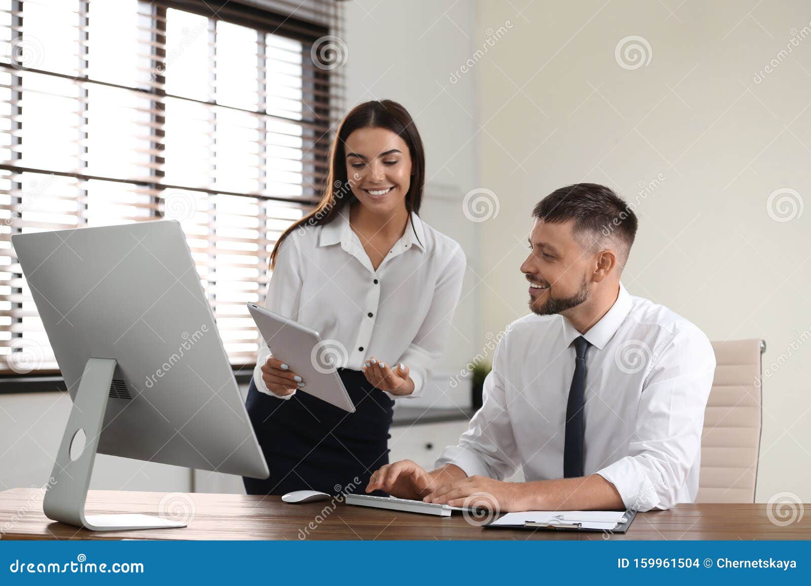 Woman Helping Her Colleague with Work Stock Photo - Image of colleague ...