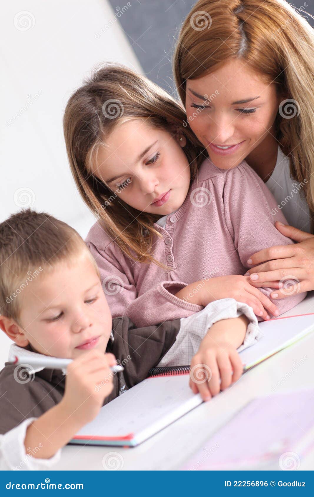 Woman Helping Kids with Homework Stock Photo - Image of kids, family ...
